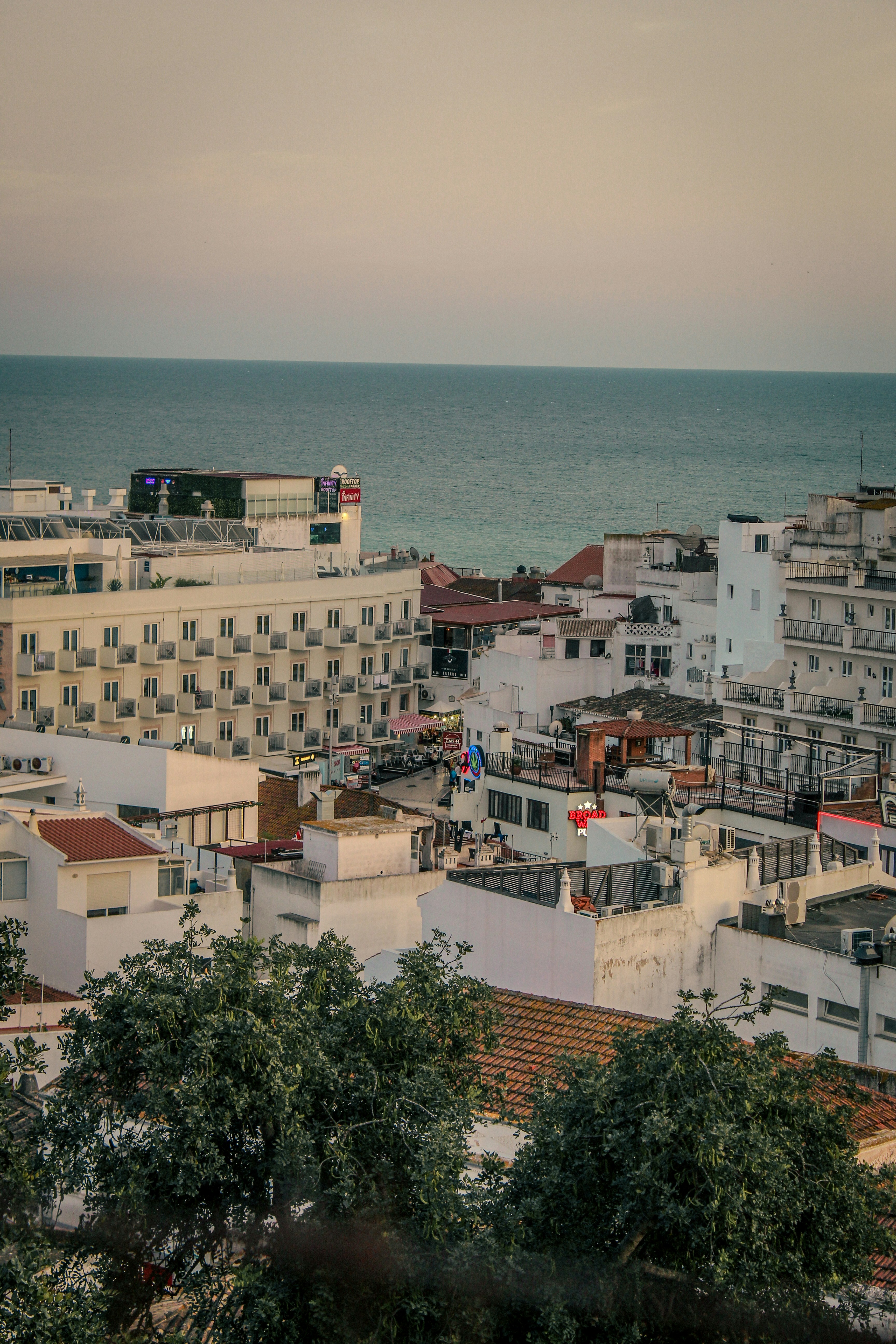 Oceanfront Mosaic: A Coastal Cityscape Above the Rooftops