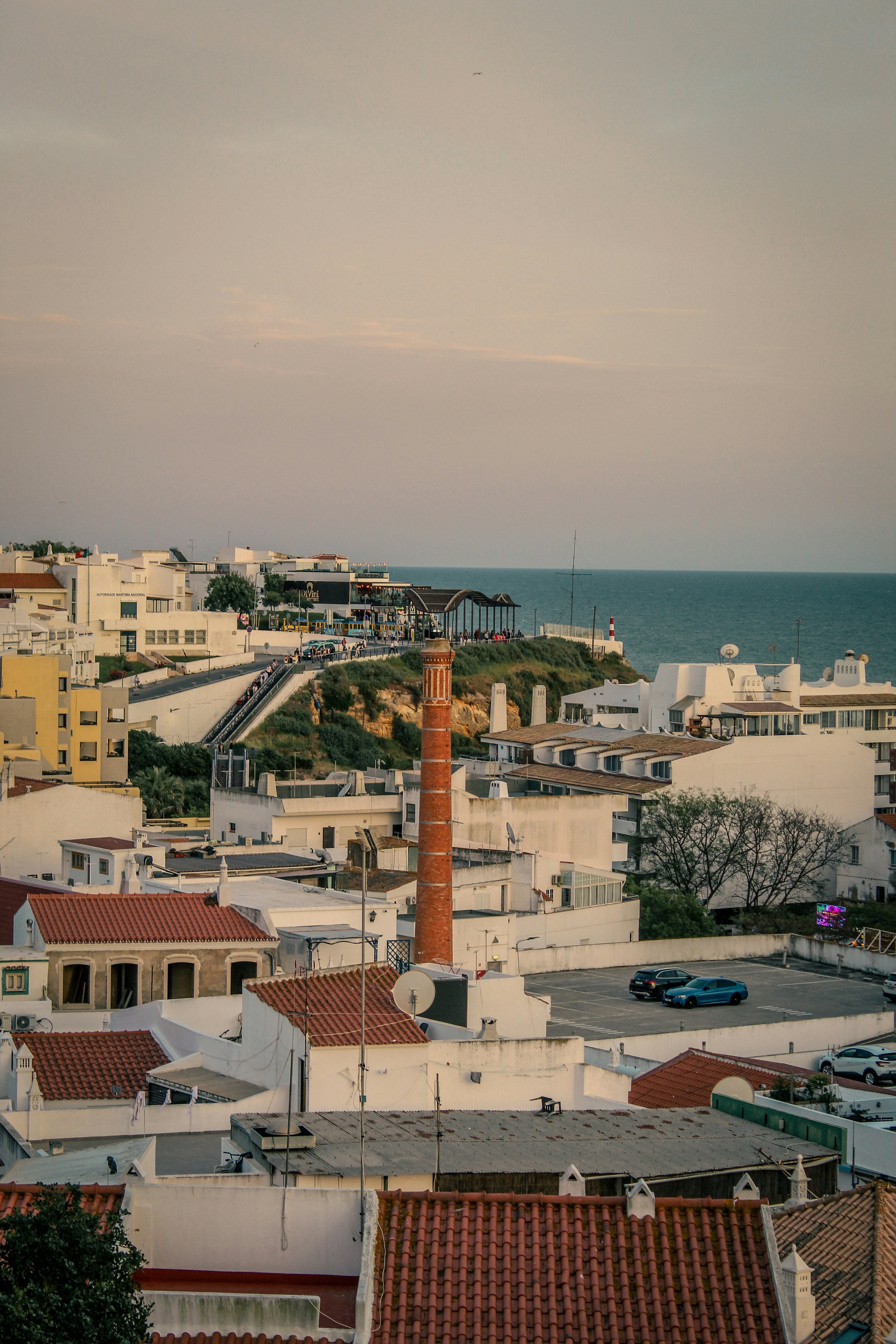 Coastal Village Panorama: whitewashed rooftops and a distant sea horizon