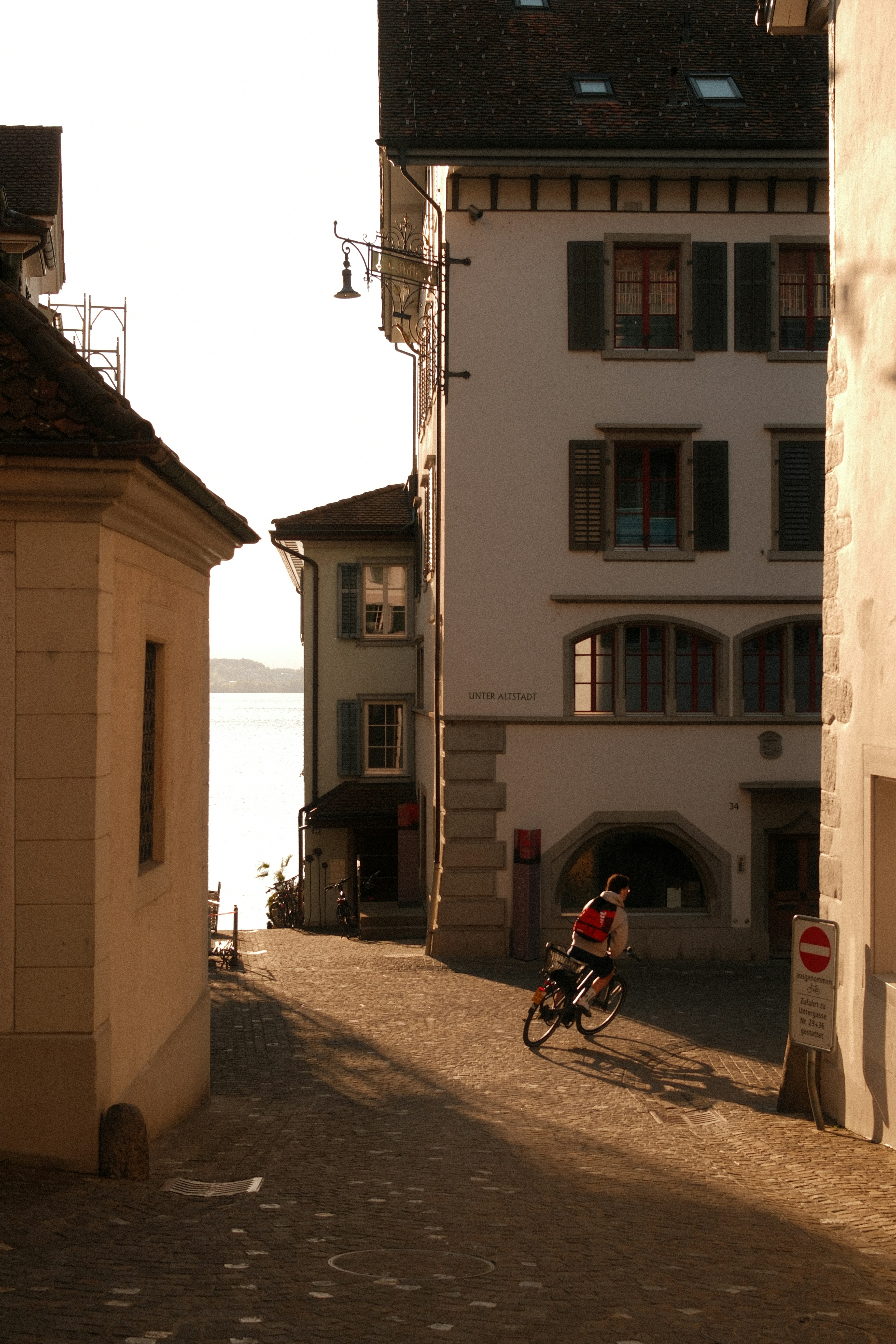 Bicycle in a sunlit Swiss-Calle: A Quiet Passage by the Waterfront