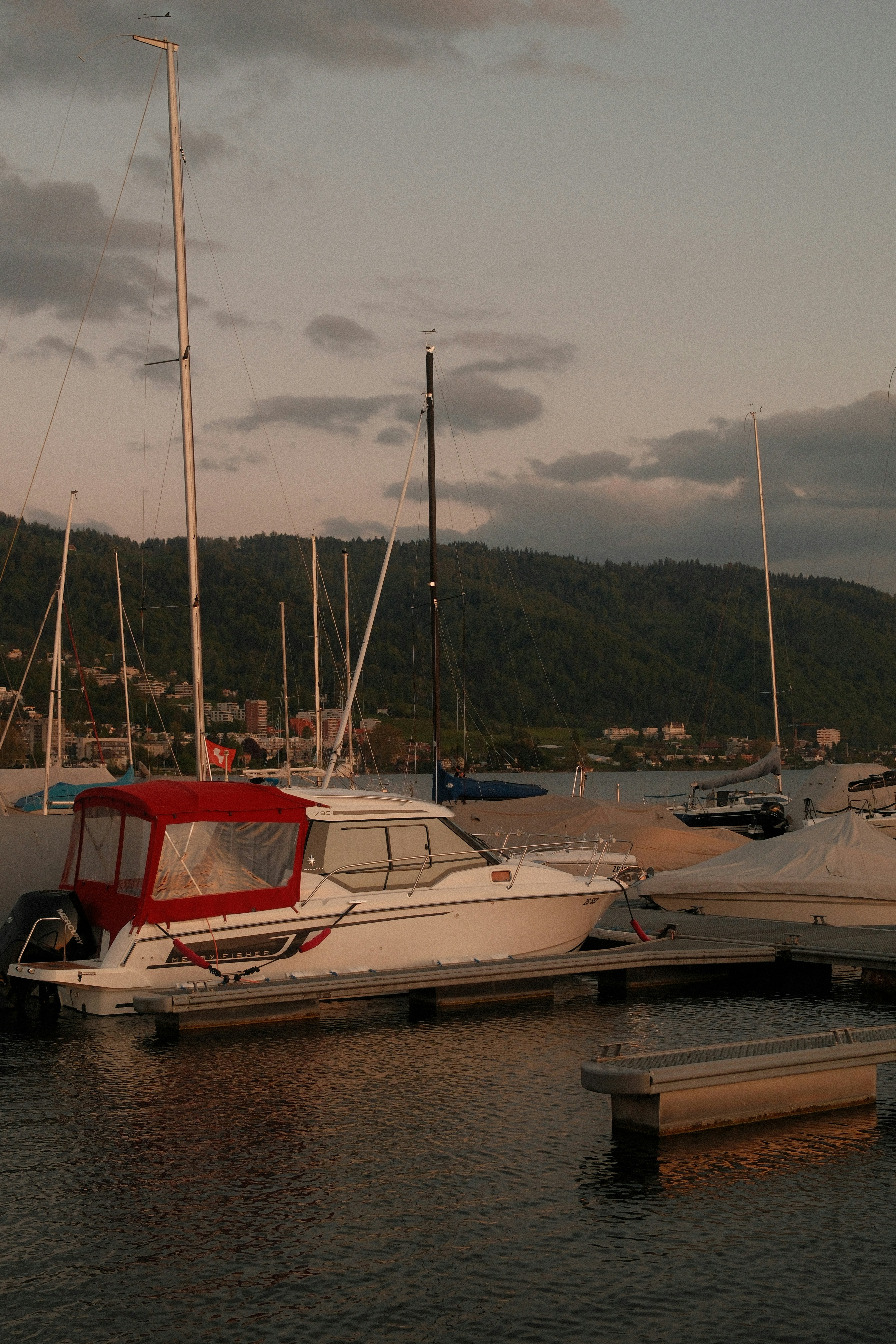 Marina Quiet: Boats Rest at Dusk Along Gentle Hills