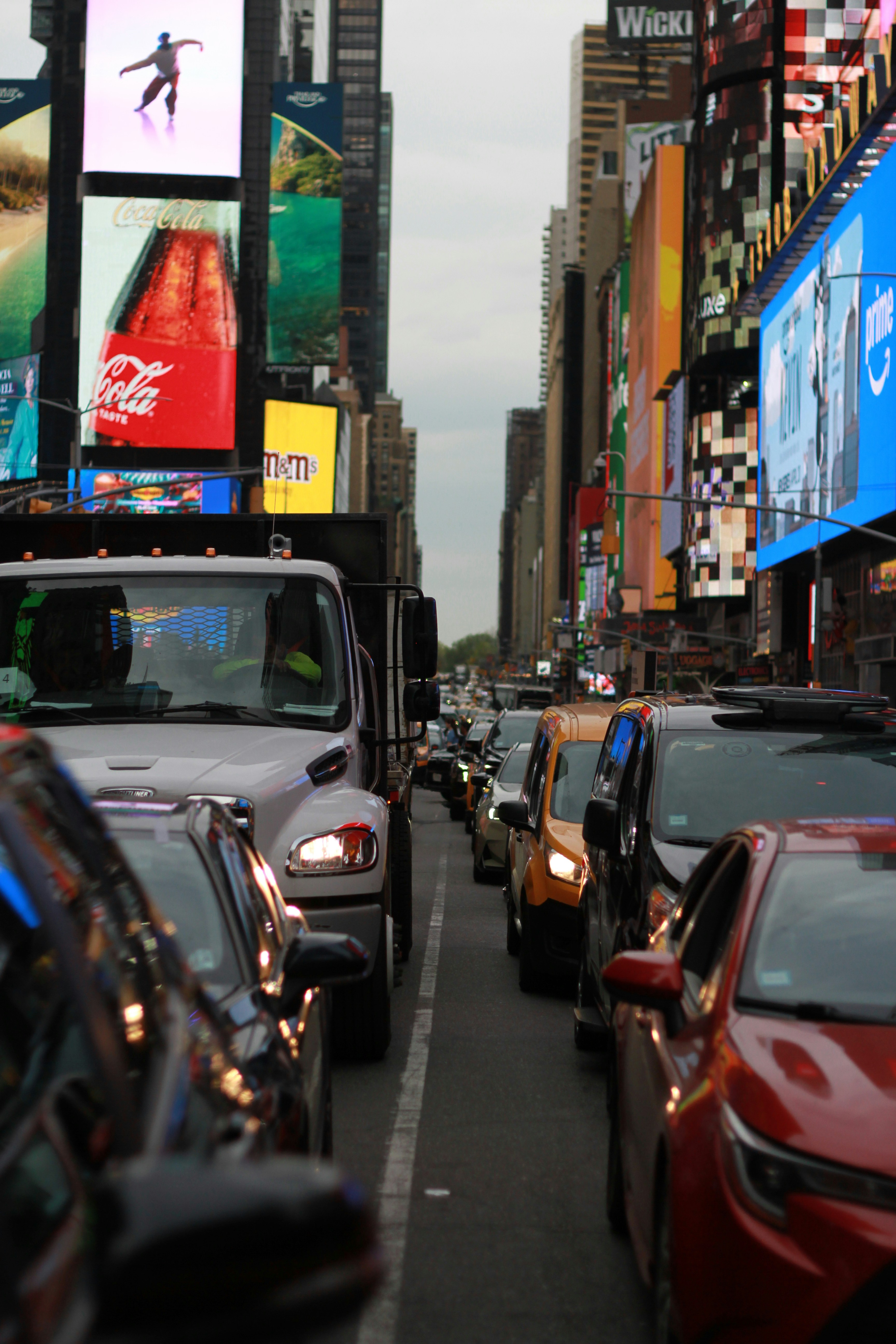 Times Square Congestion: Neon Giants Amid Traffic