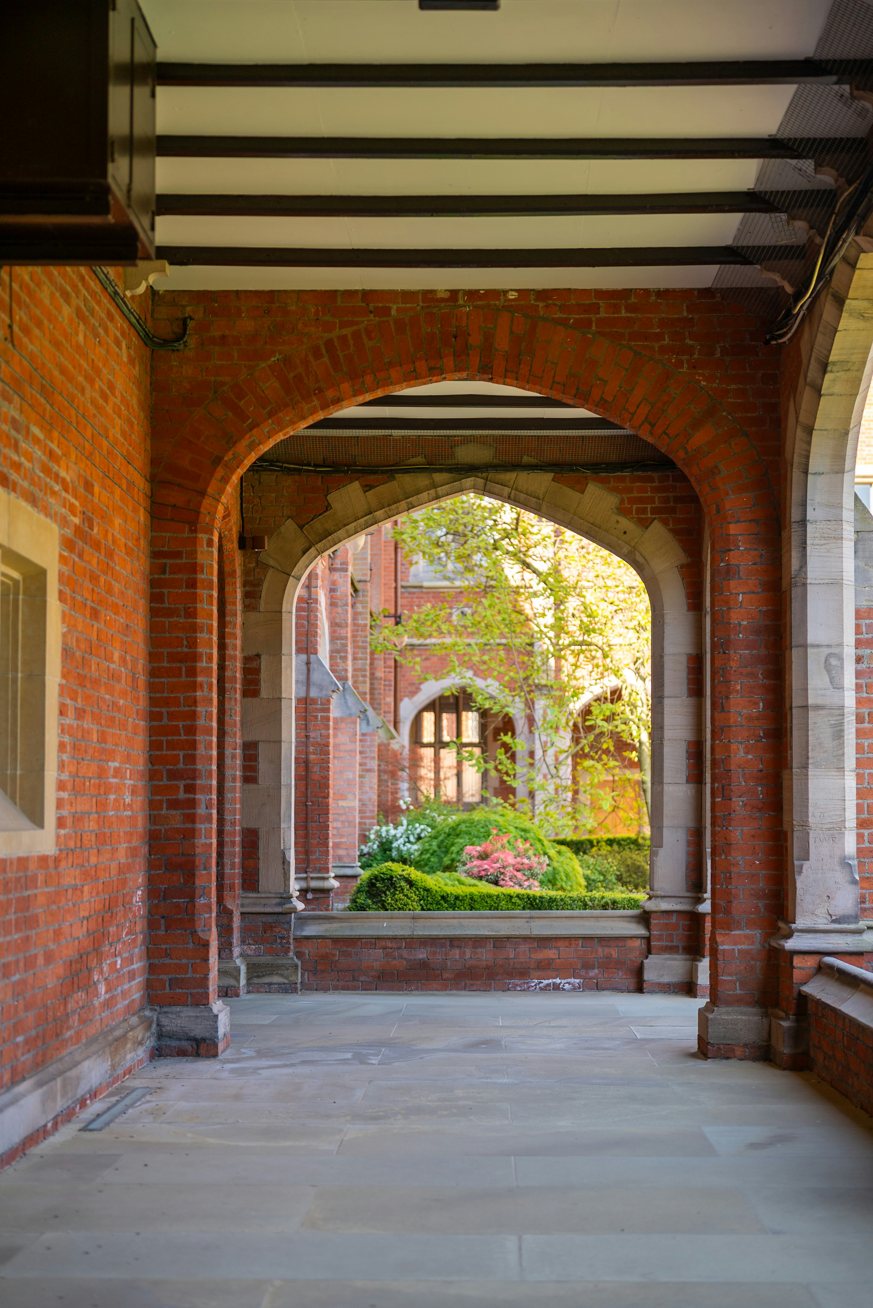Brick Archway Corridor Framing a Garden Vista