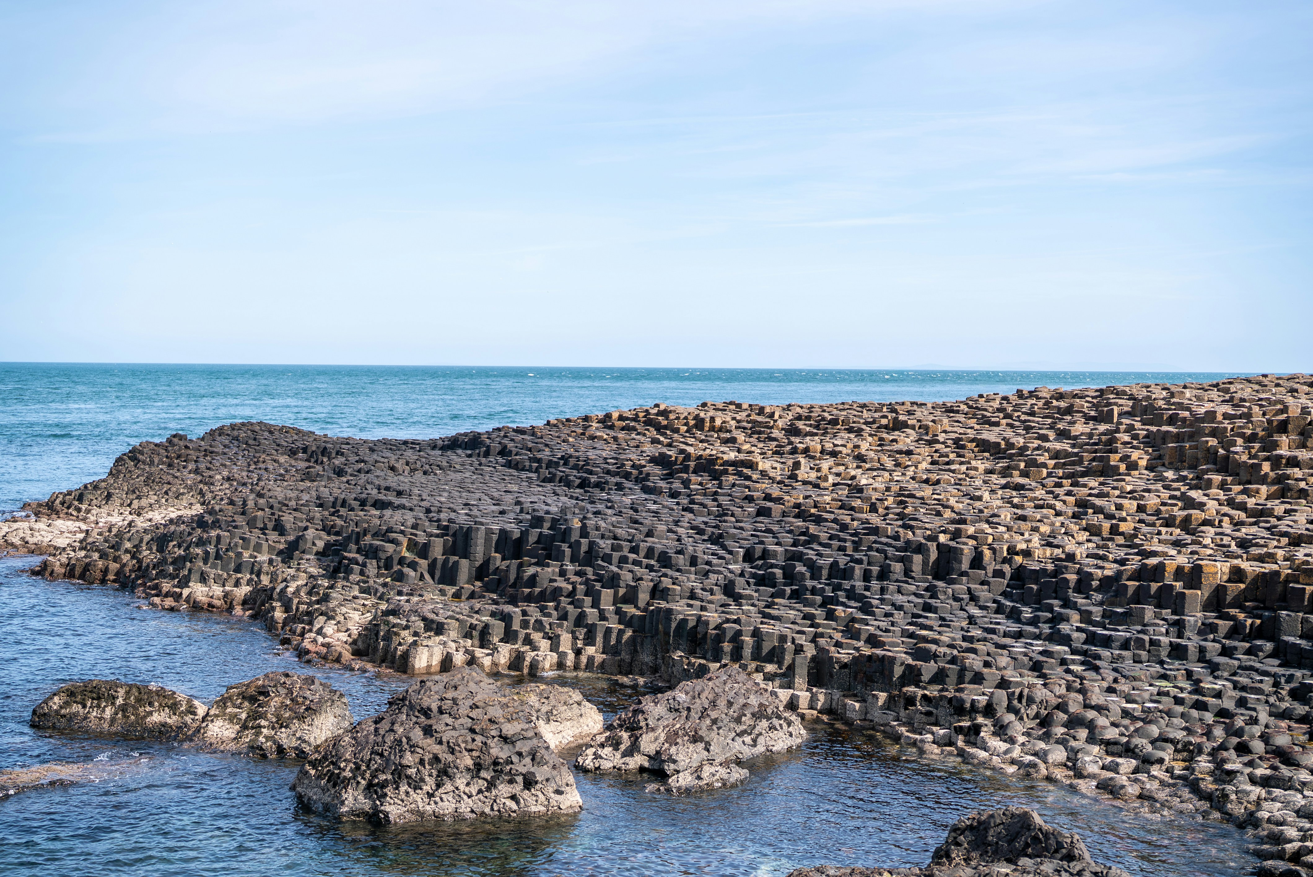 Hexagonal Tide: A Sea of Basalt Dunes Meet the Open Horizon