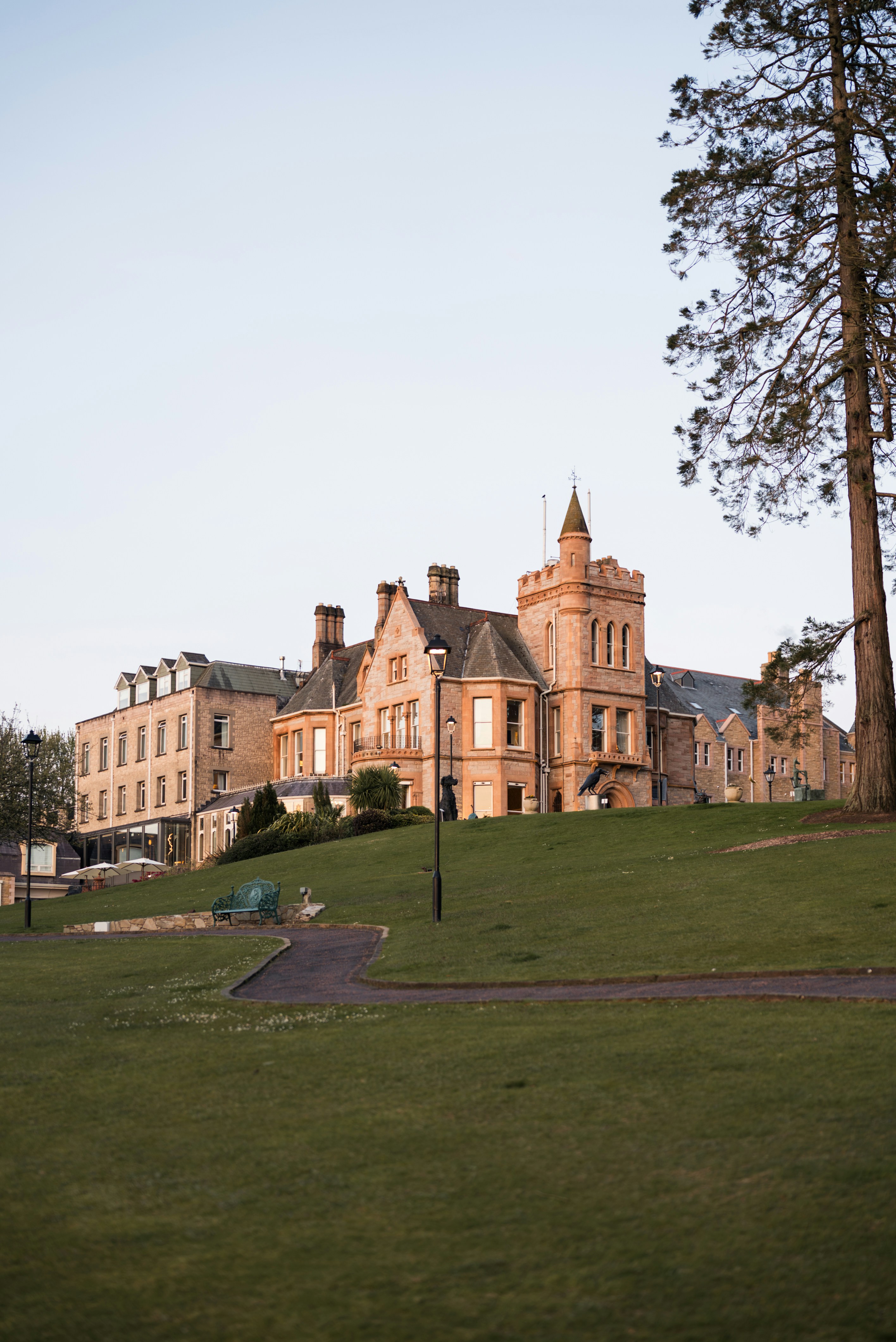 Castle on the Hill: Sunlit Brickwork and Quiet Path