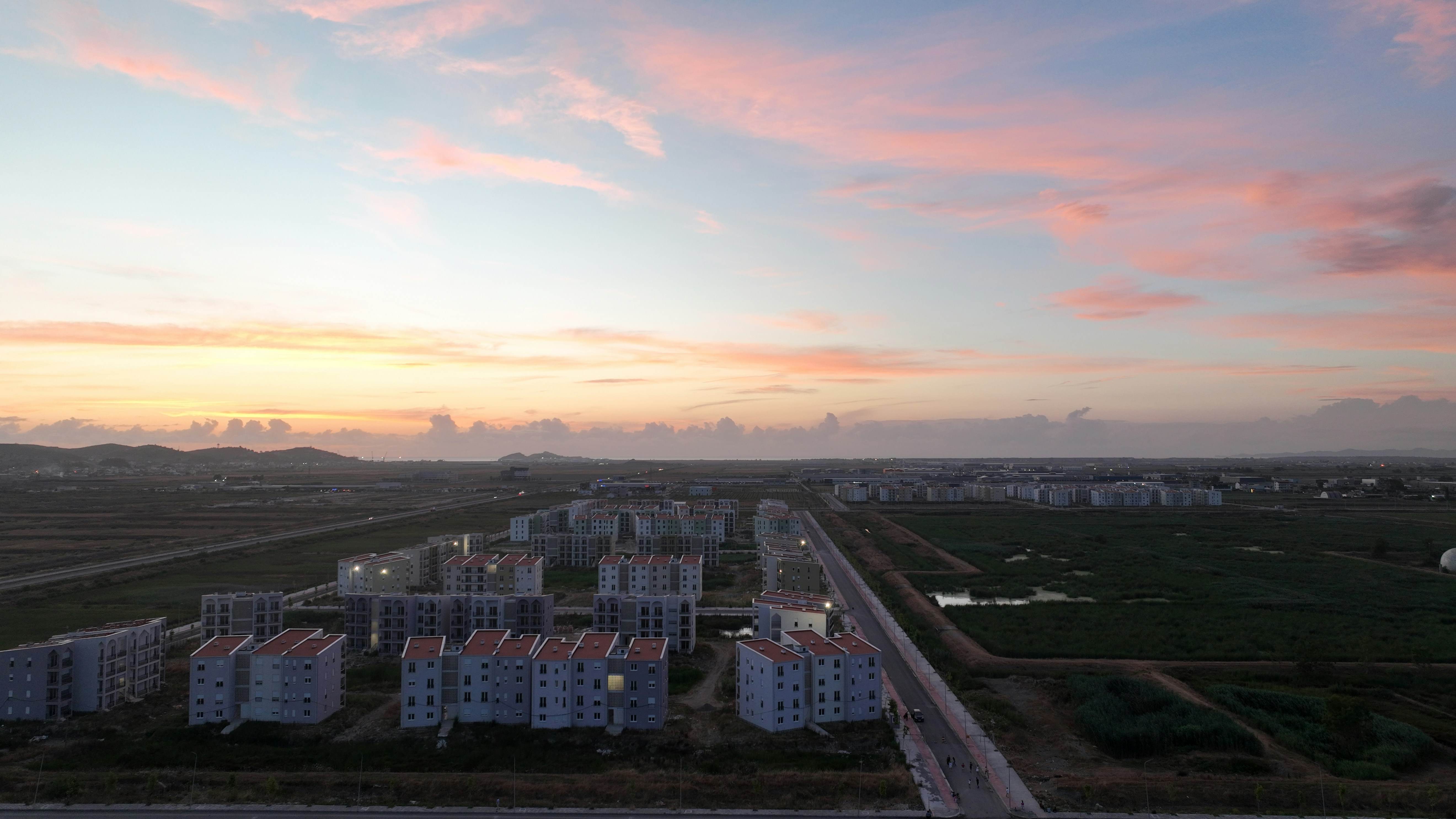 Sunset Over a Quiet Housing Patch: Edge of the City Glistens