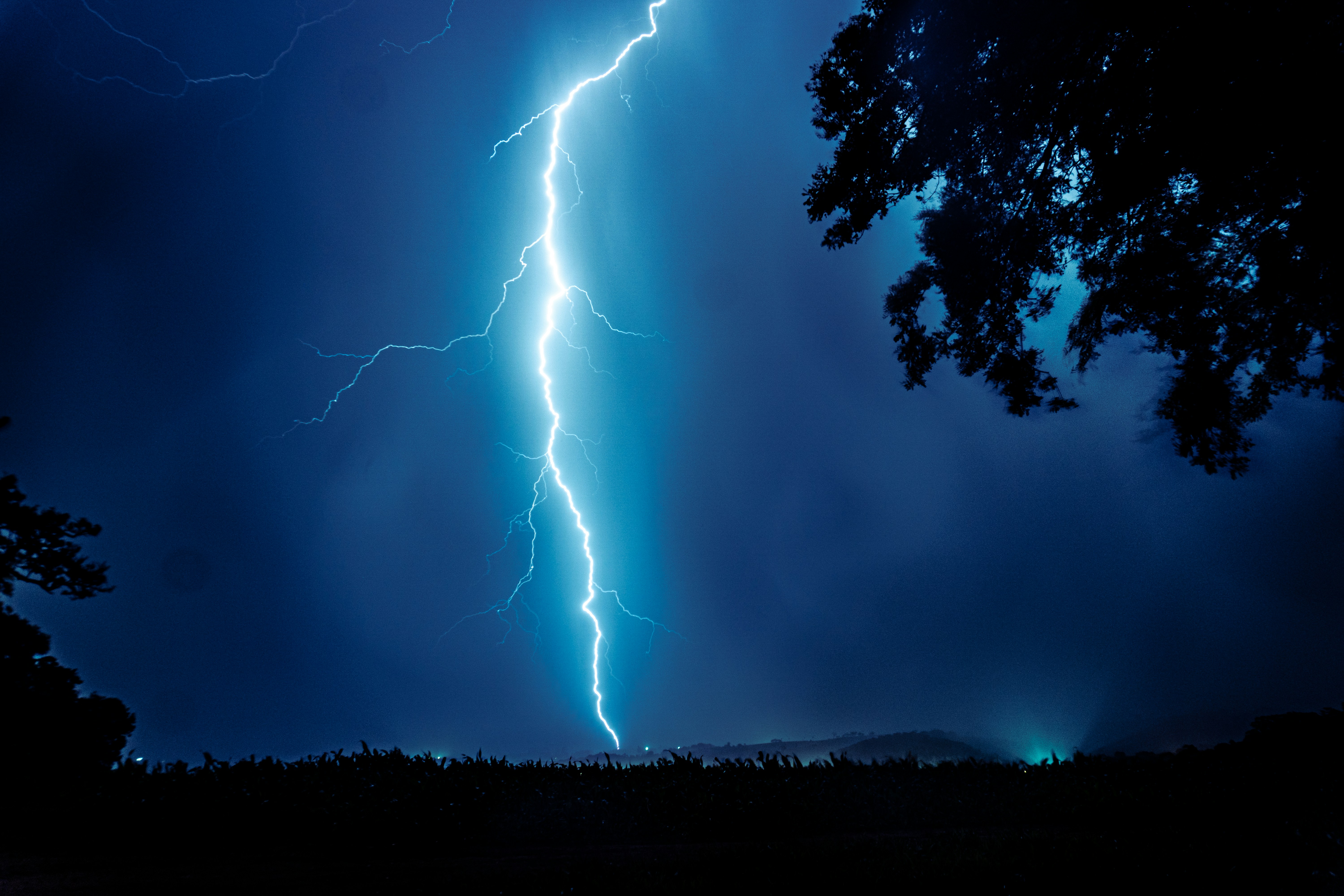 Bolt Across Night: A Blue-Hour Lightning Strike