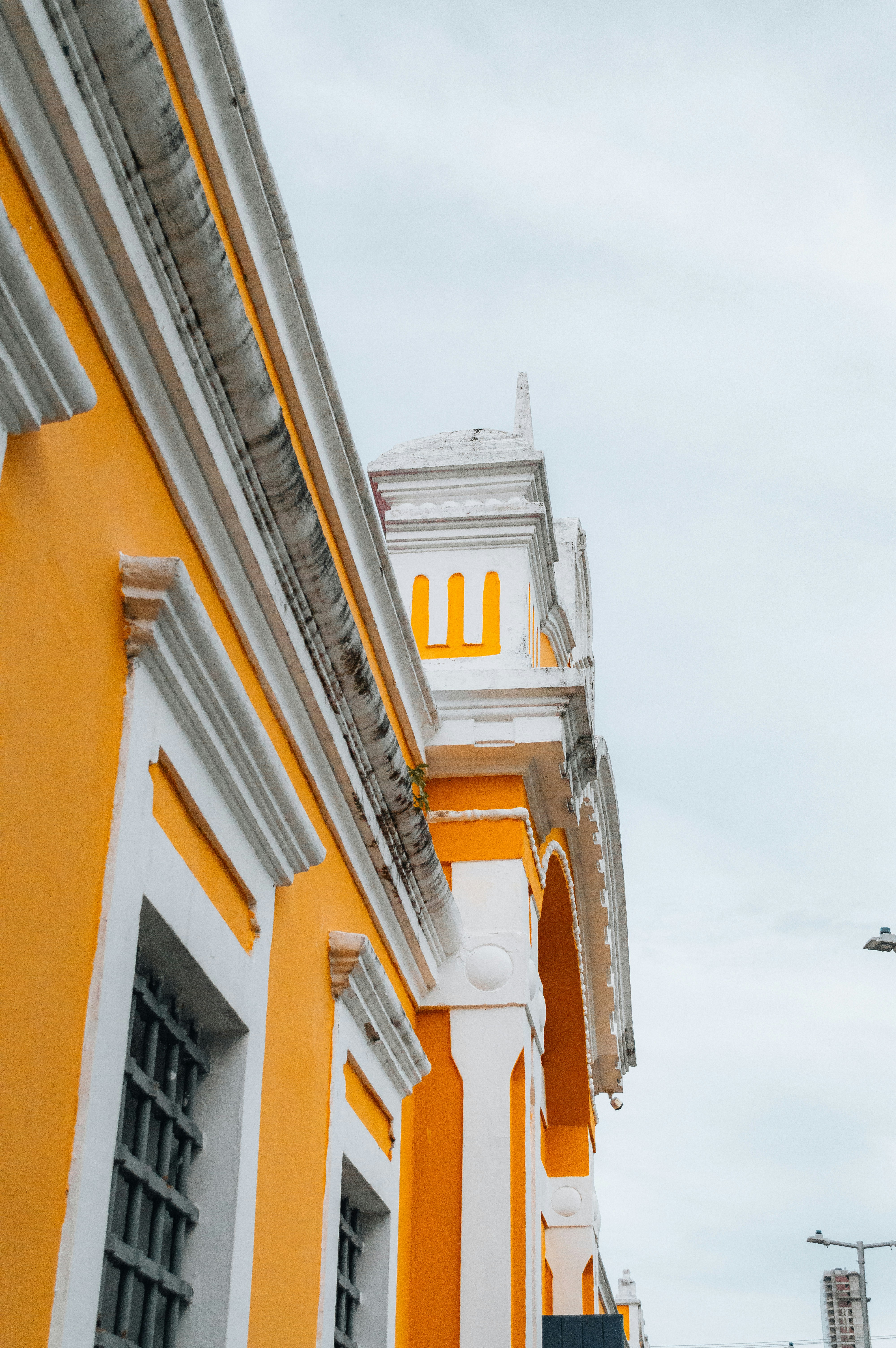Sunlit orange-and-white façade: a diagonal shot of architectural detail