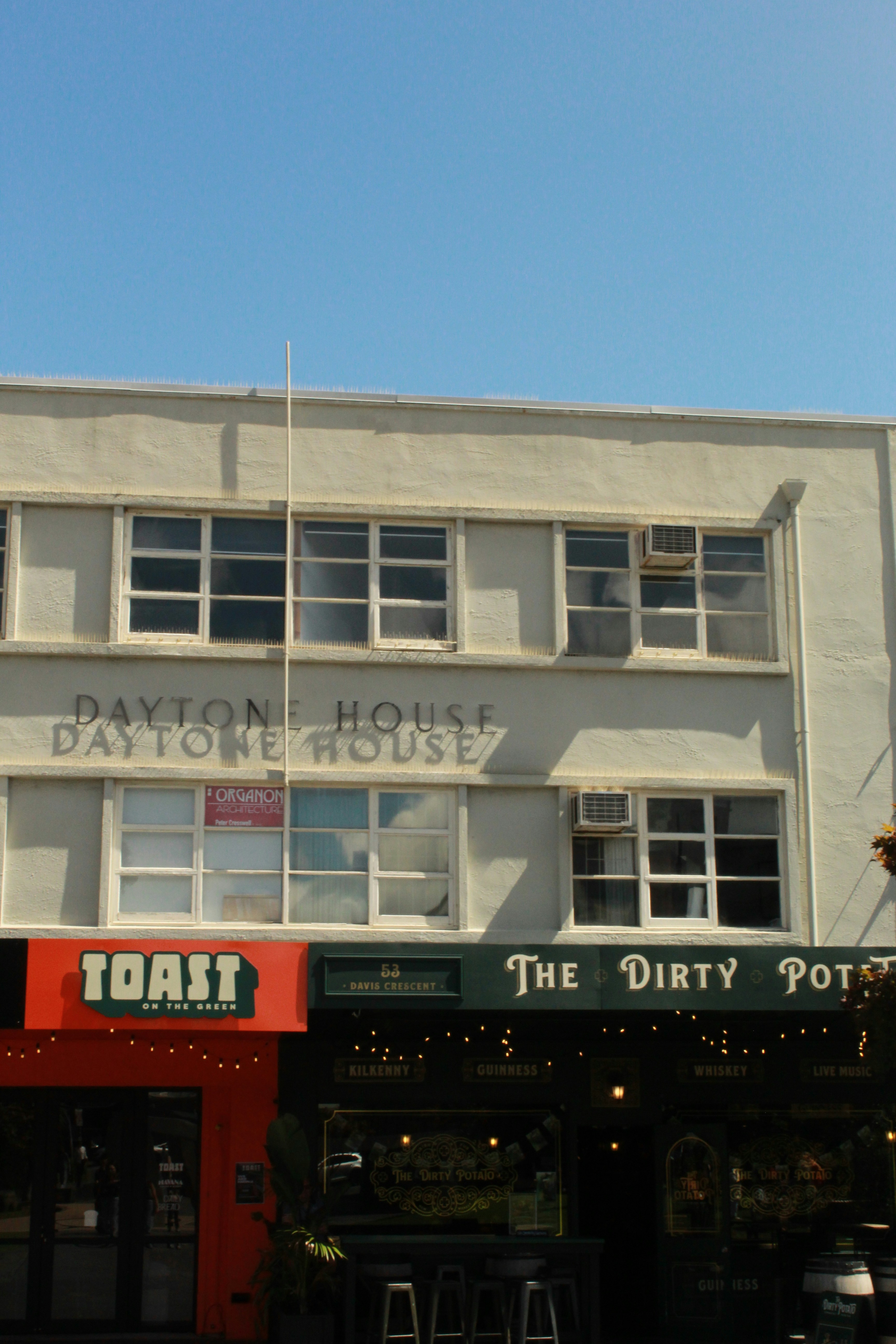 Daytona House Facade Adrift Between Sky and Signage