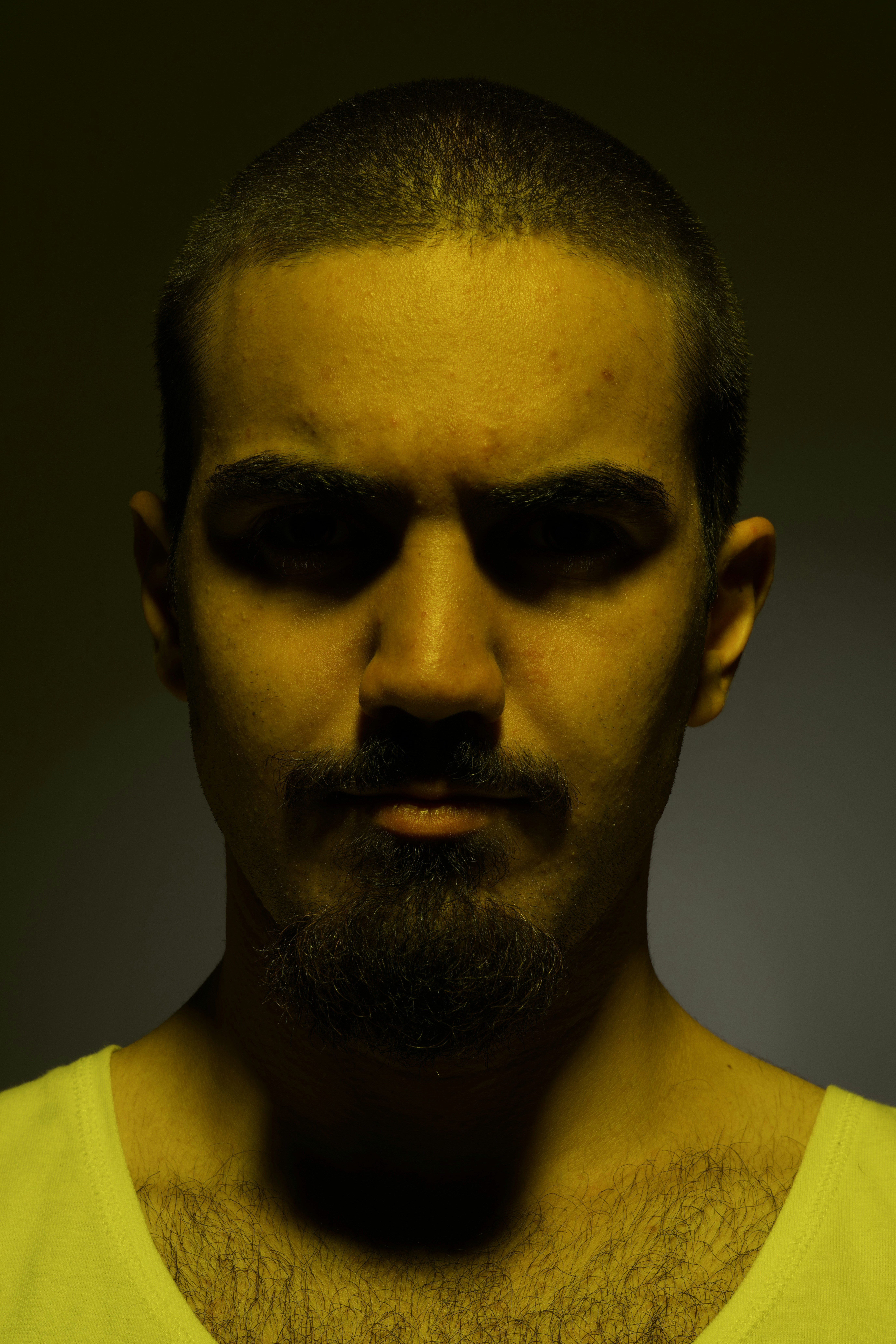 Midnight Gaze: A Quiet, Shadowed Portrait Under Warm Lighting