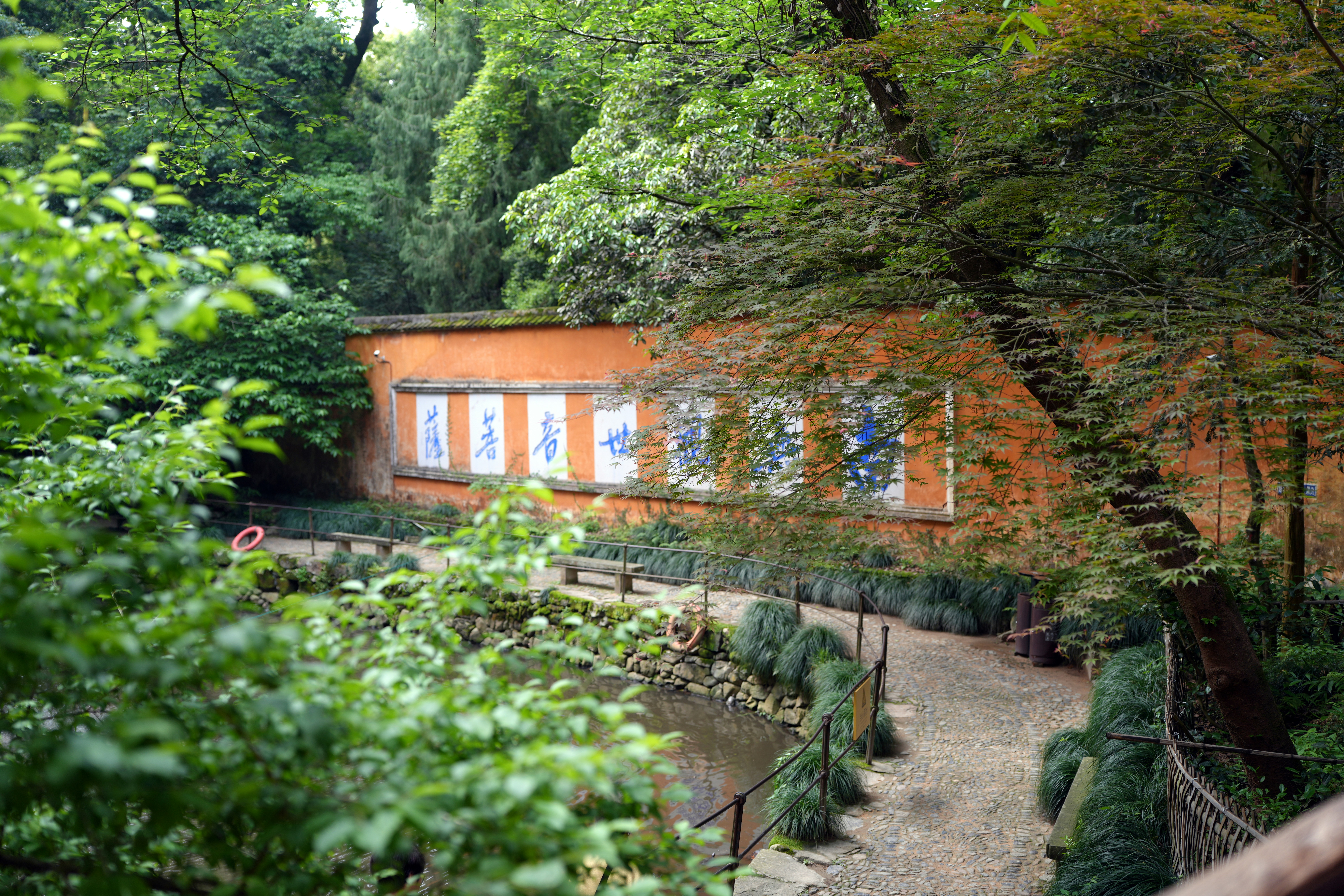 Ceramic-panel Corridor Framed by Greenery