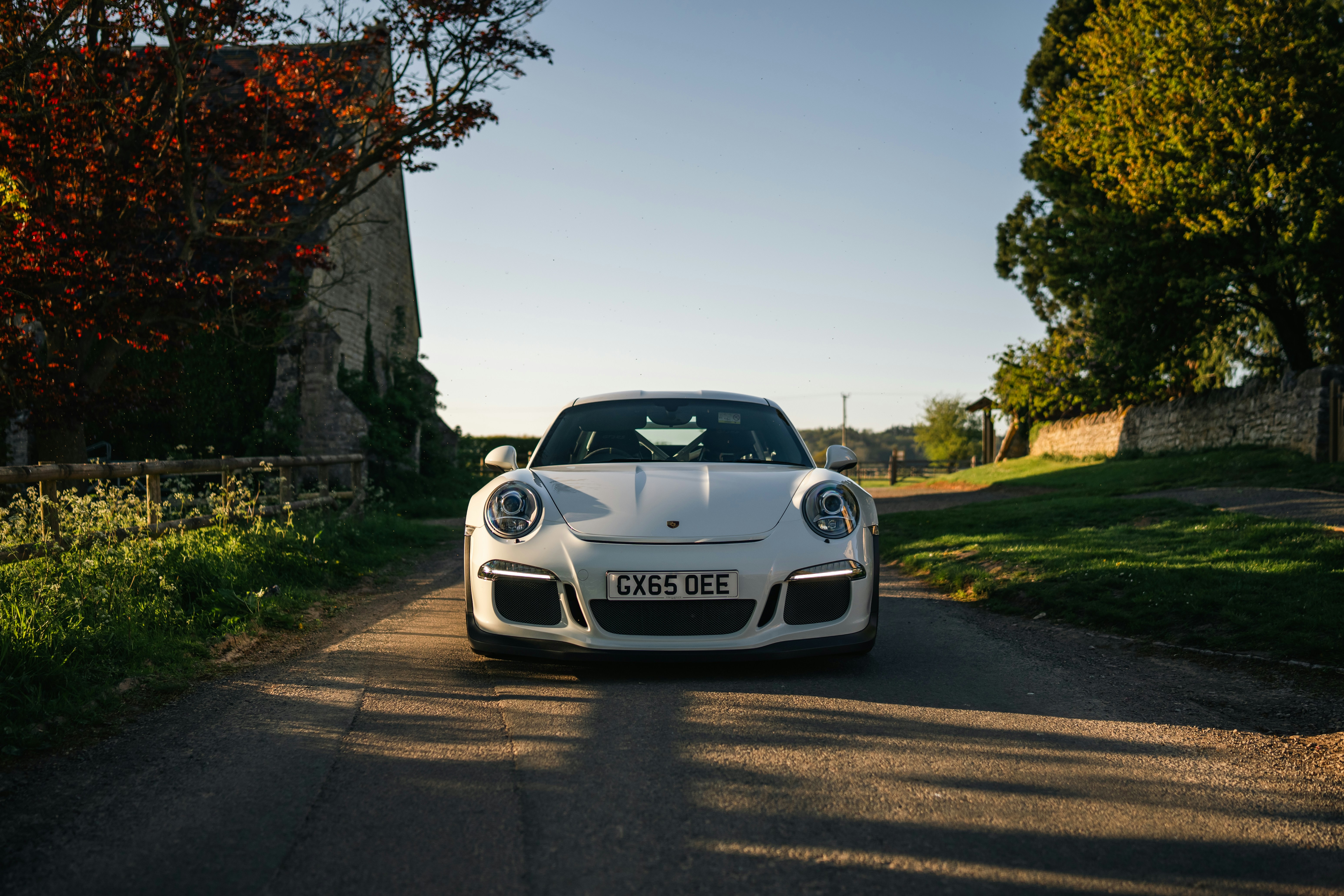 White Porsche on a Quiet Country Road