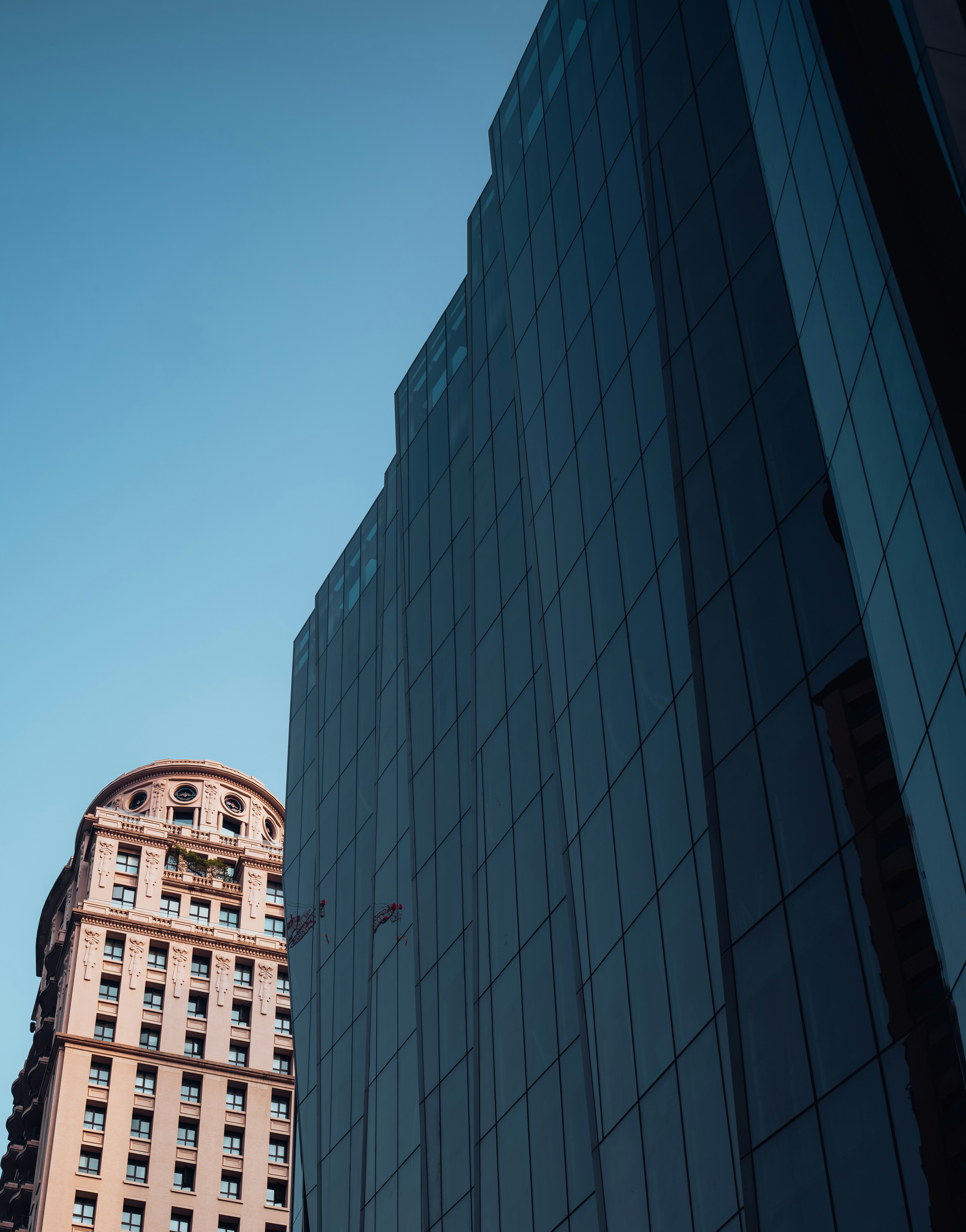 Edge of Glass and Brick: A City Facade in Quiet Tilt