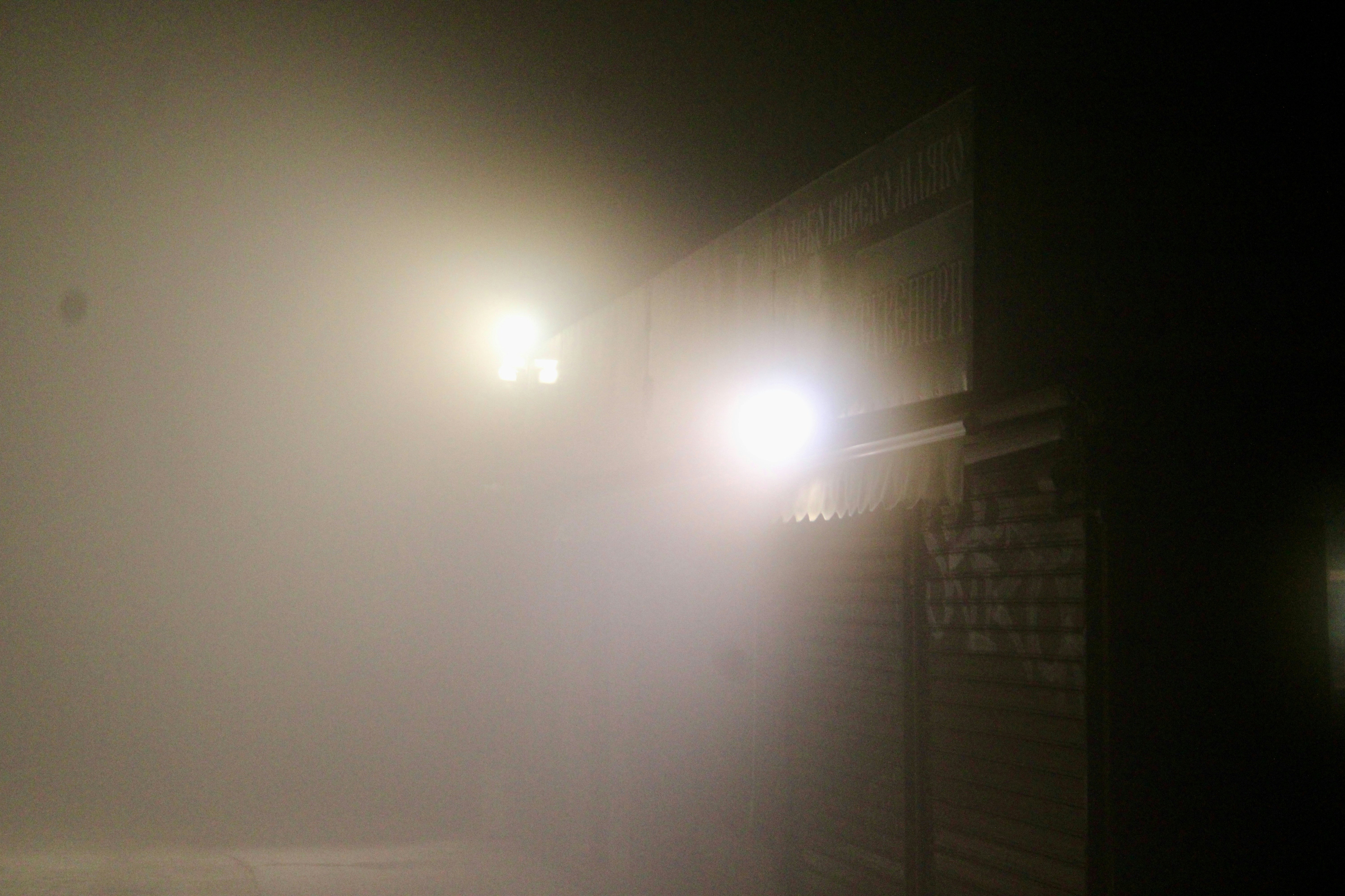 Fogbound Streetlight: A Glowing Veil Over a Quiet Corner