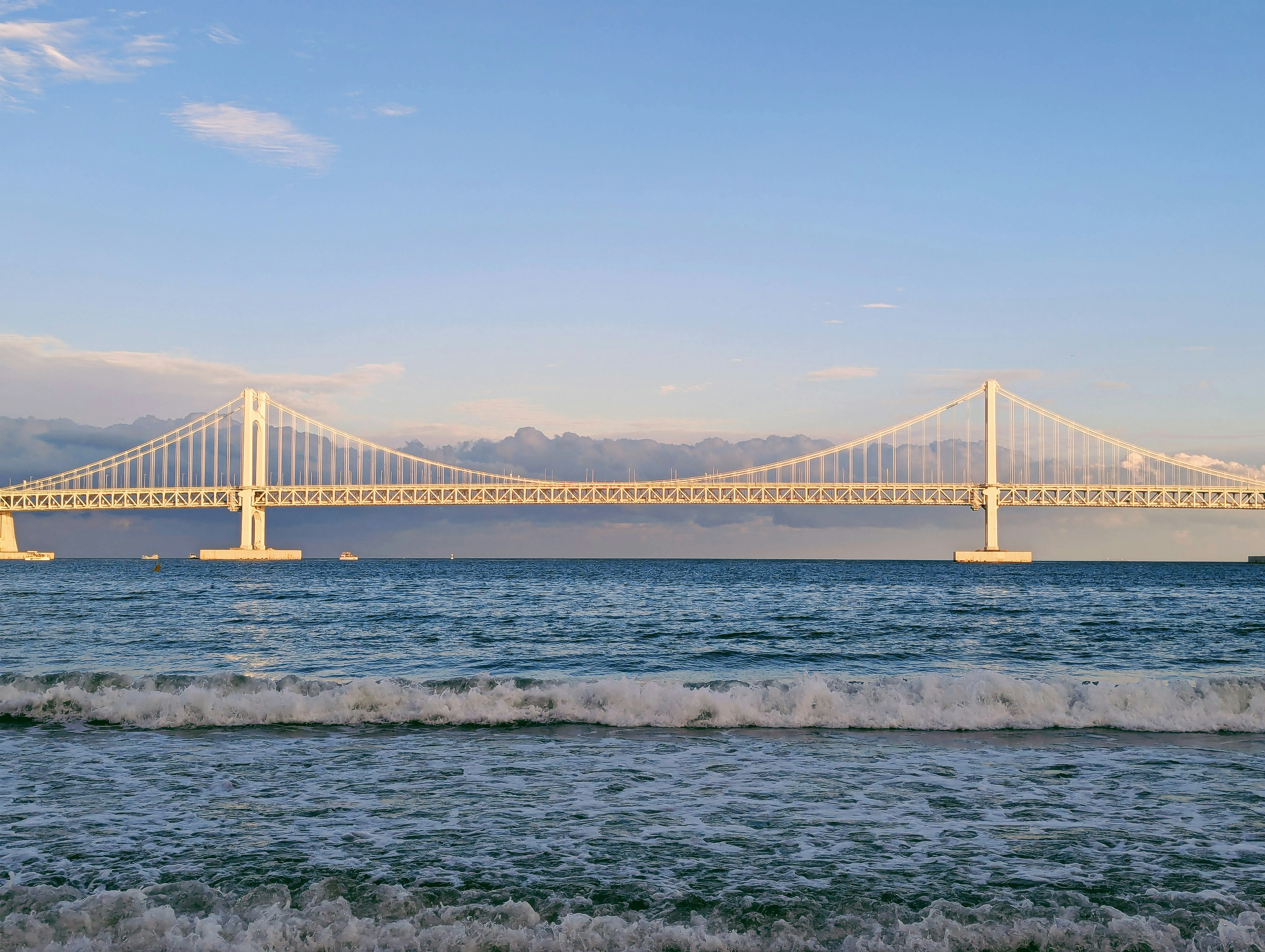 Suspended Span at Dusk: A Coastal Bridge Crossing the Quiet Sea