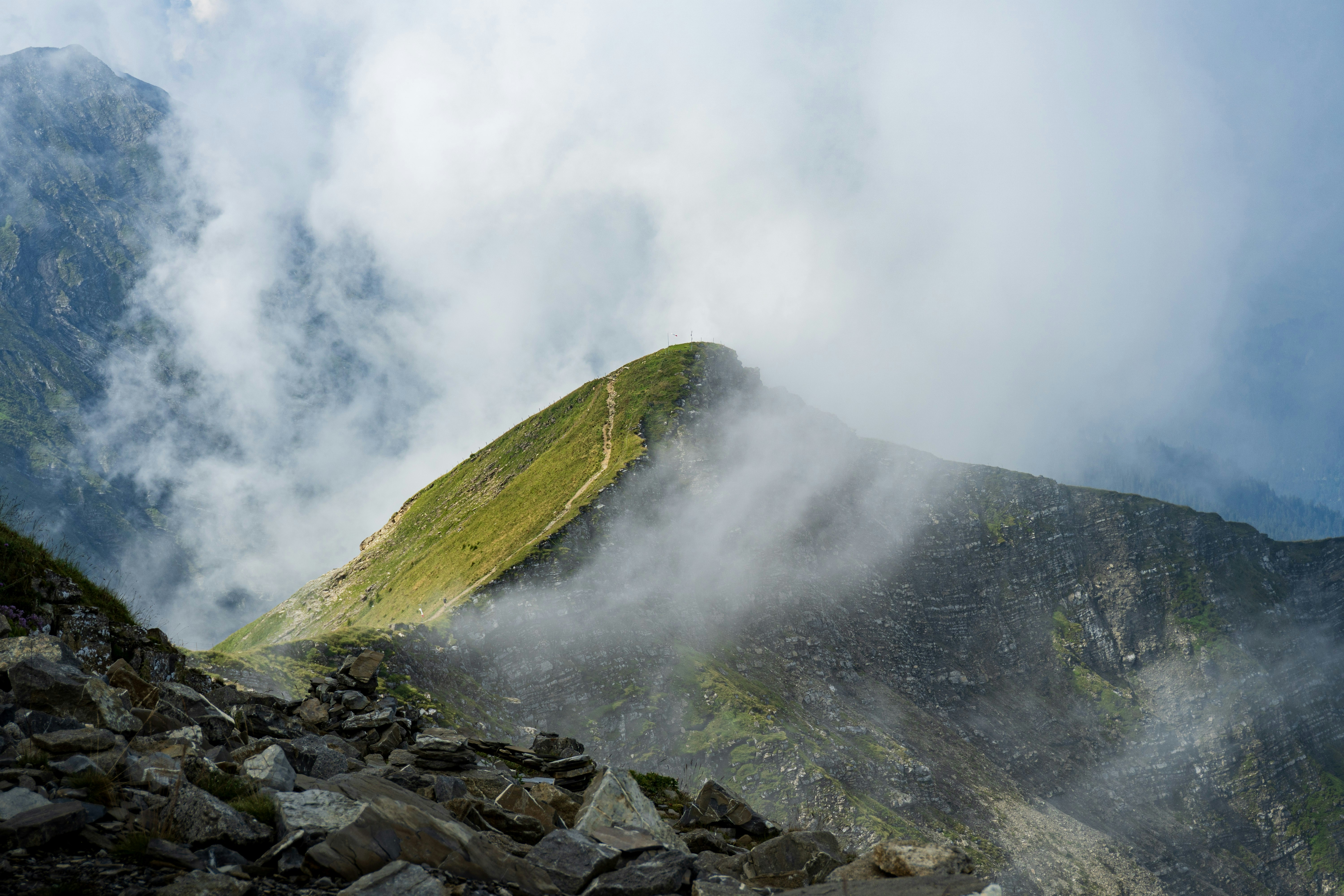 Mist-Clad Summit Path Carved Through Morning Mist