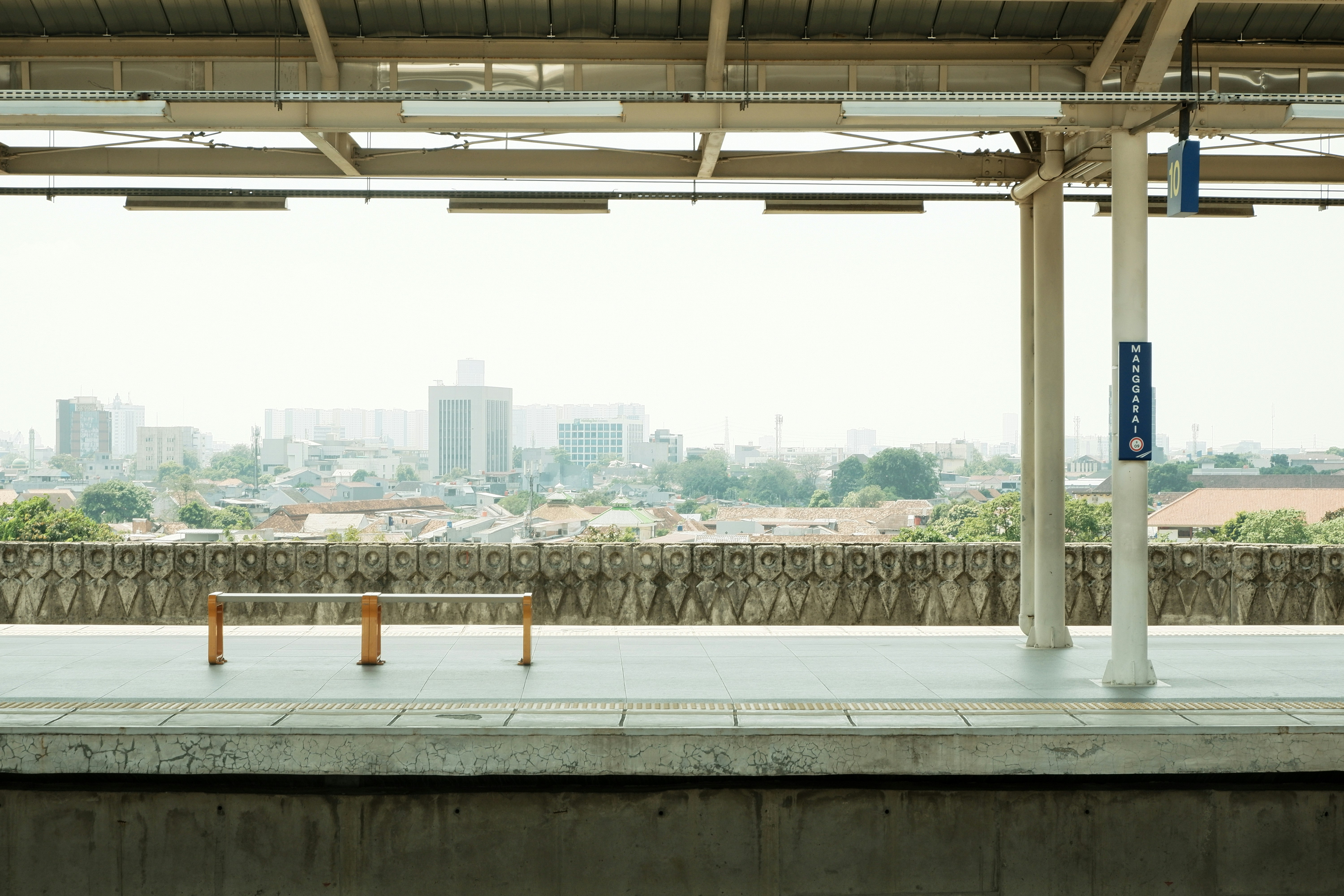 Quiet Platform Overlooking a Distant Cityscape