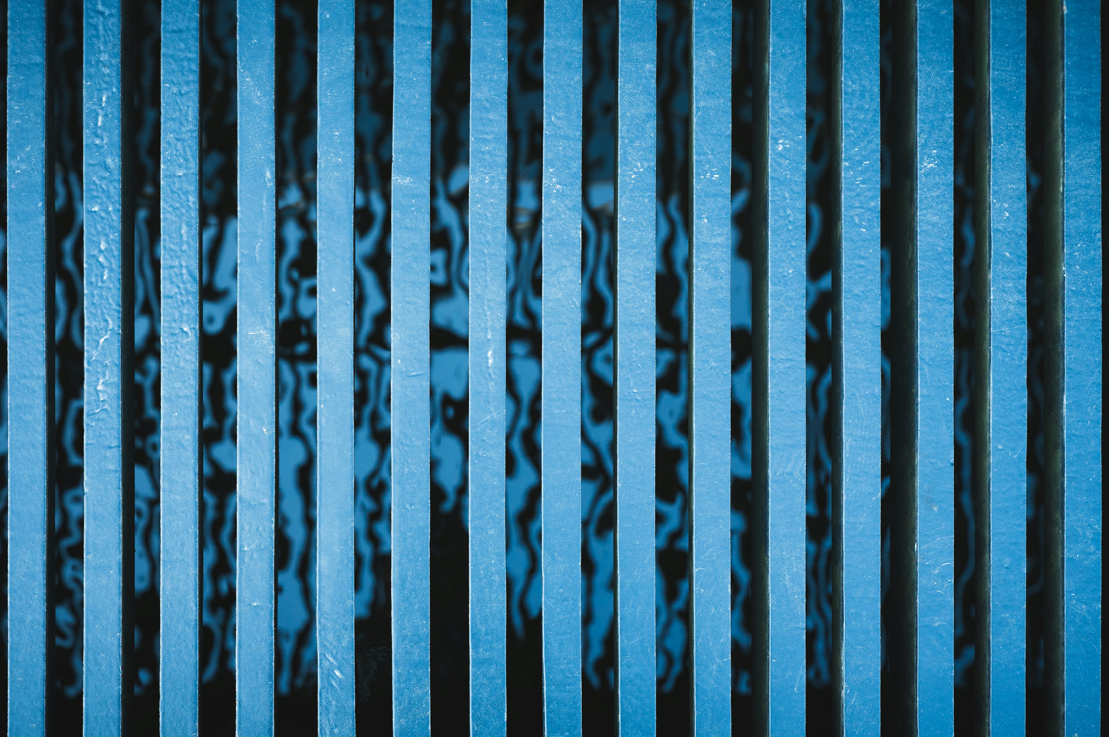 Blue Vertical Bars: Tethered Light and Shadow