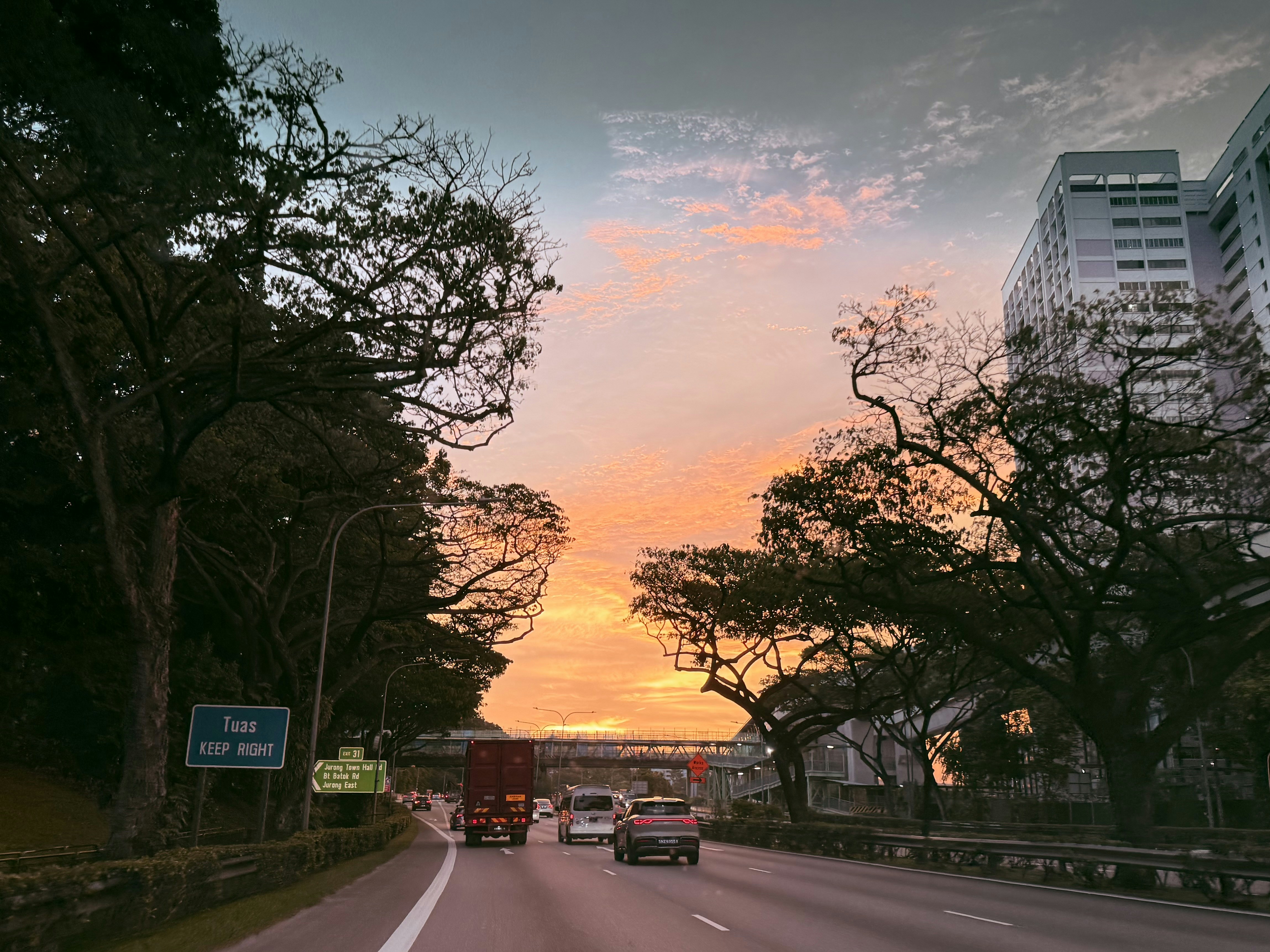Sunrise Dash: City Road Toward a Glowing Horizon
