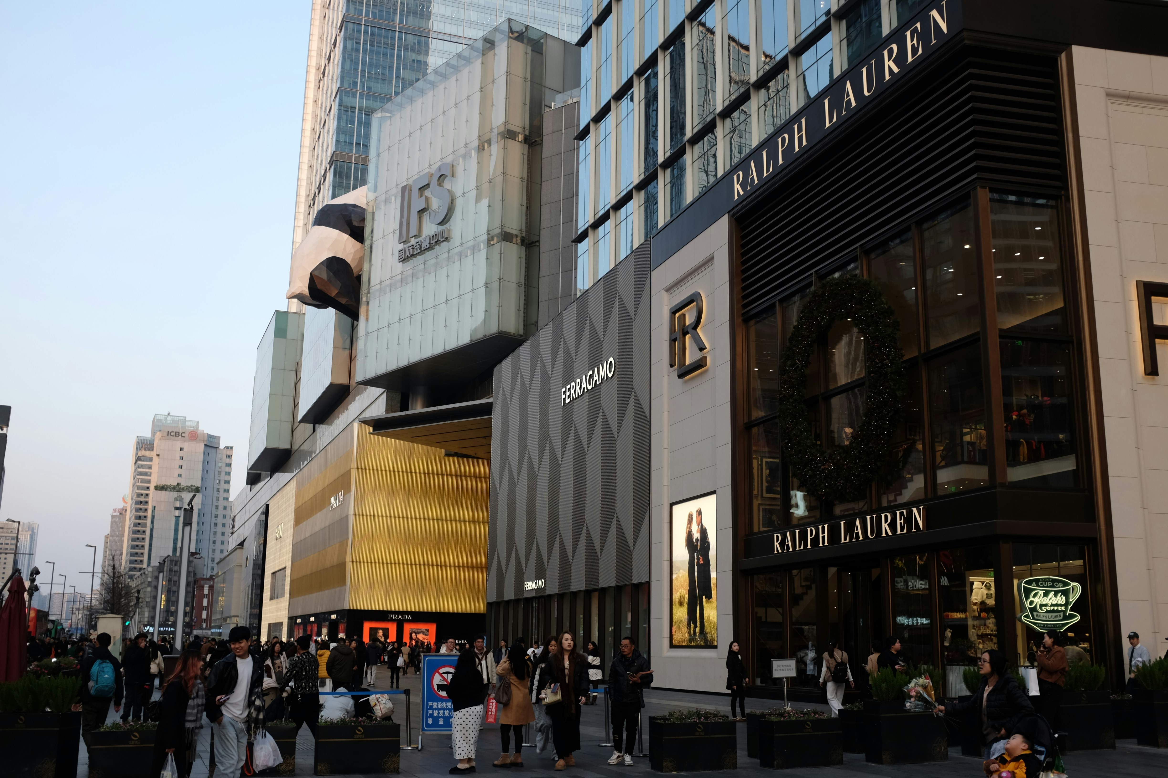 Urban Facade Pulse: Shoppers and Storefronts along a Modern Boulevard