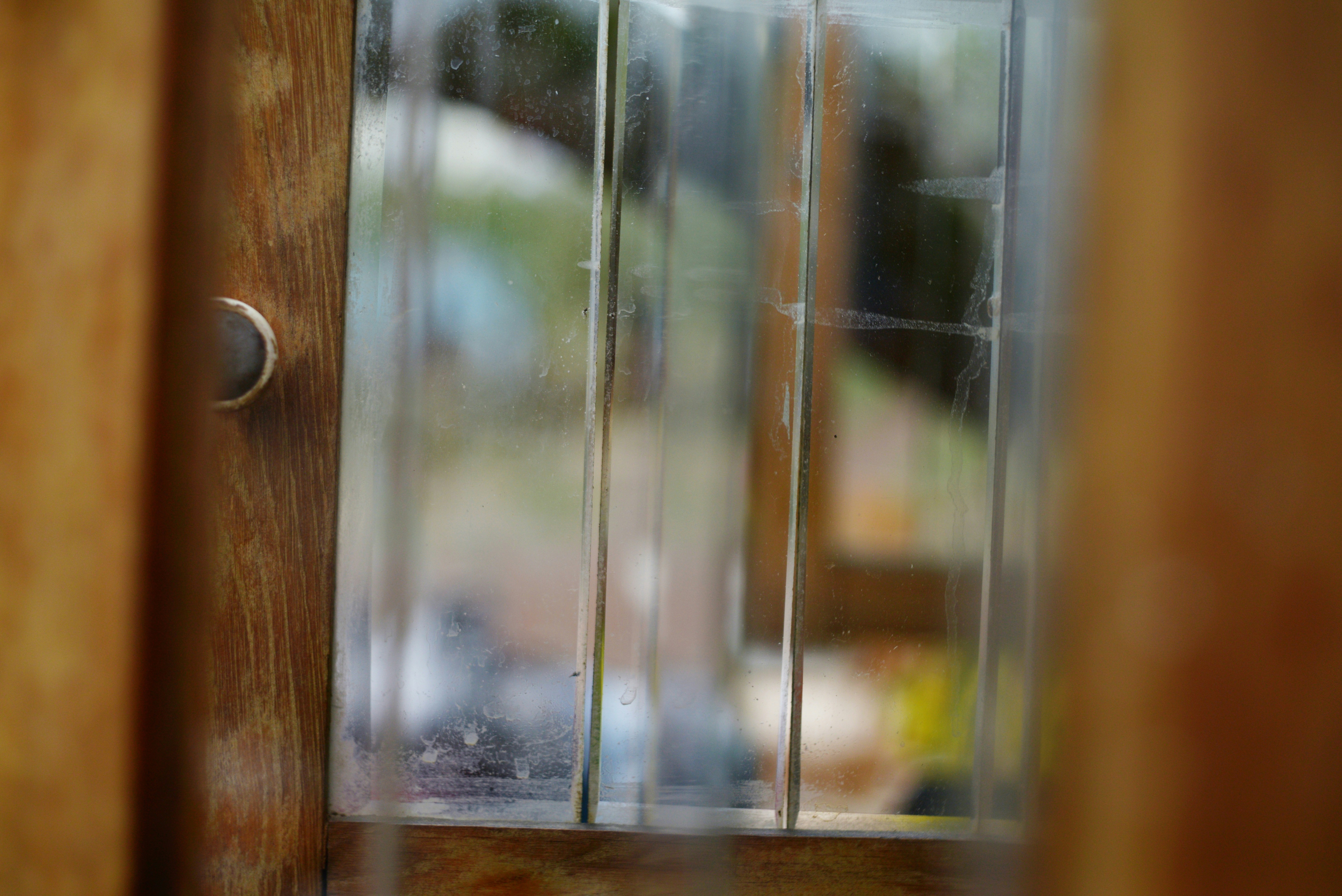 Through a Narrow Window: Framed View Beyond Wood and Glass