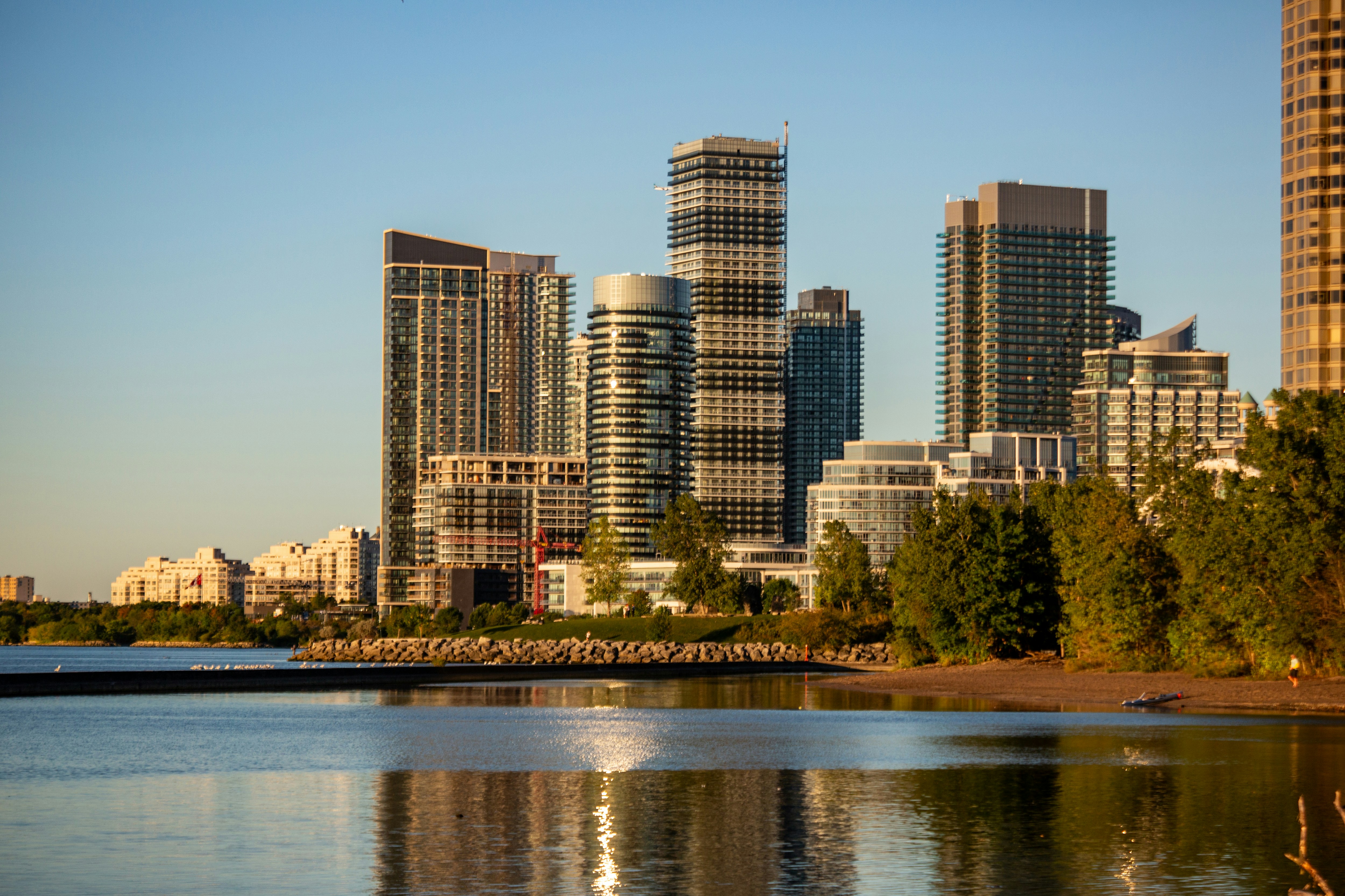 Sunlit Skyline Reflecting on Quiet River