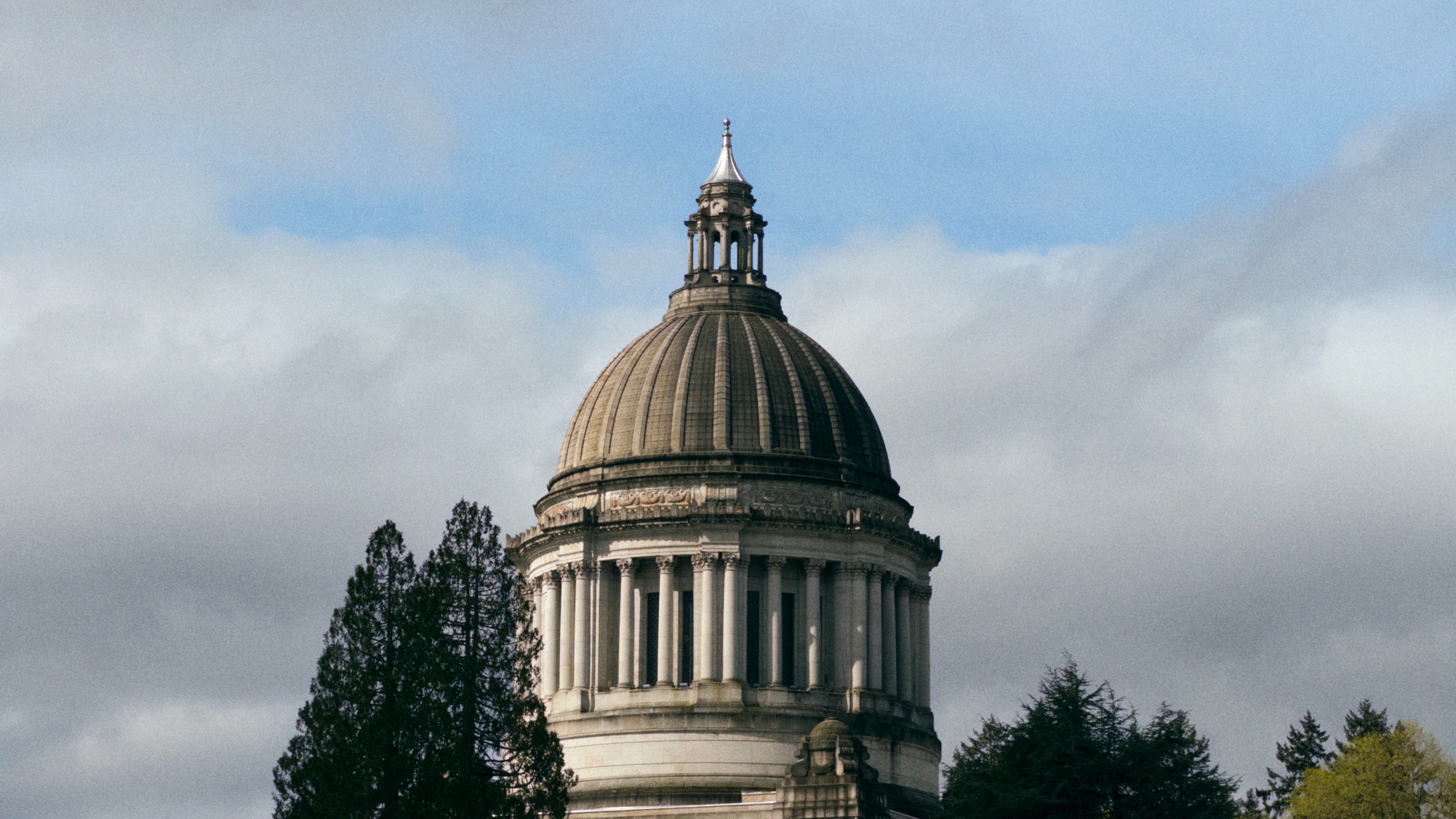 Dome of Inquiry: Capitol Silence Beneath Clouded Skies