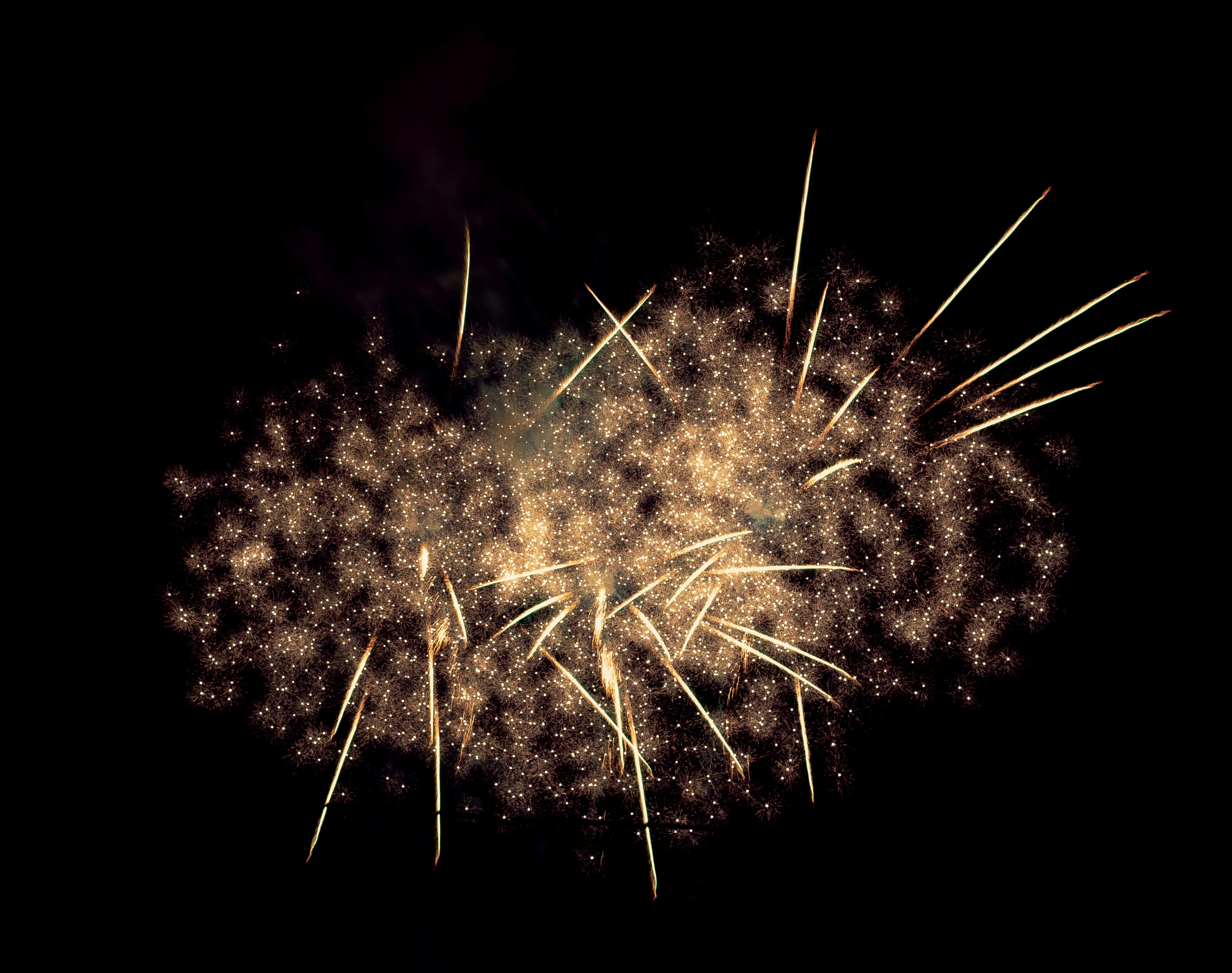 Centered Burst: Night Sky Embers in Quiet Darkness