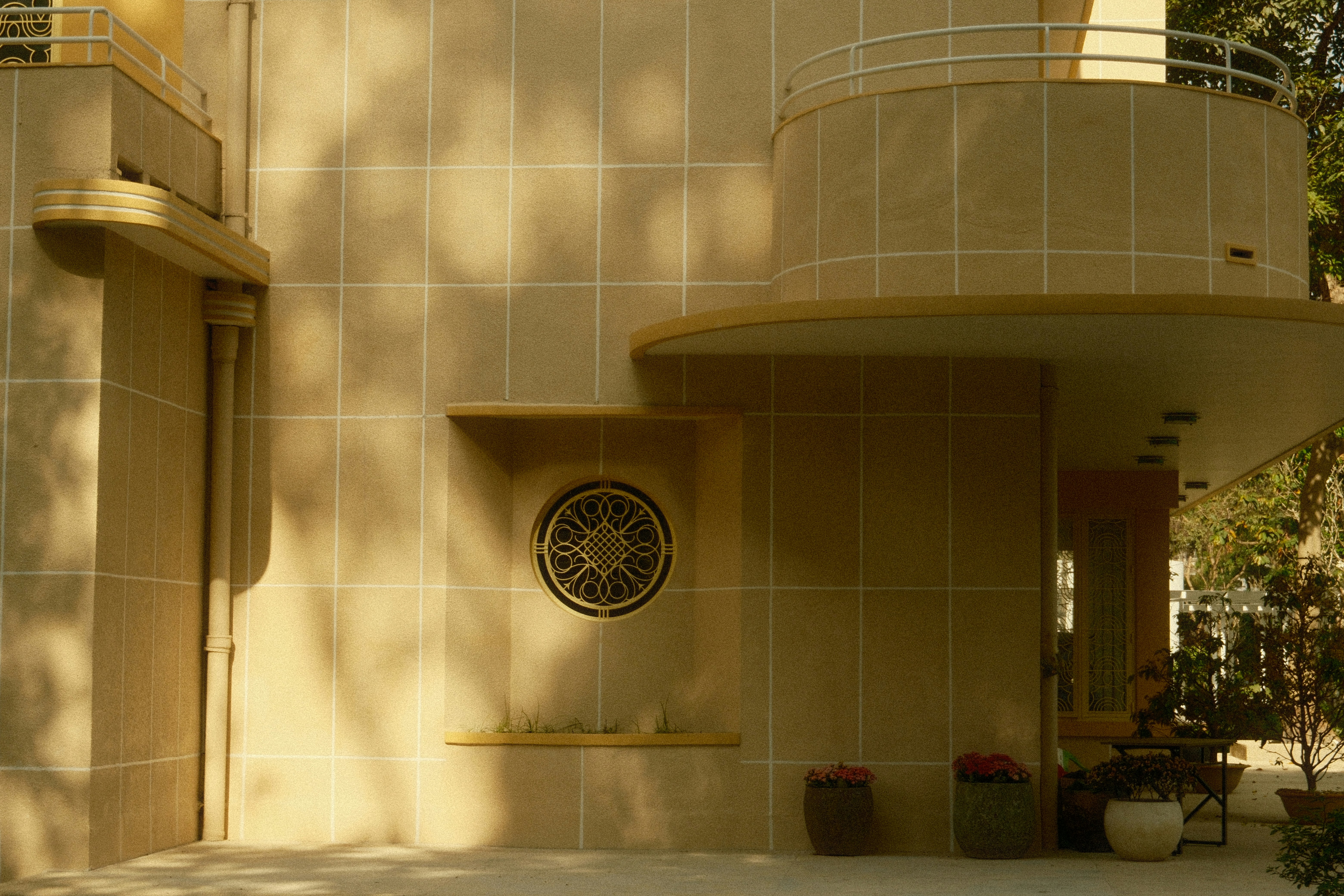 Circular Vent with Shadowed Facade in Warm Urban Lighting