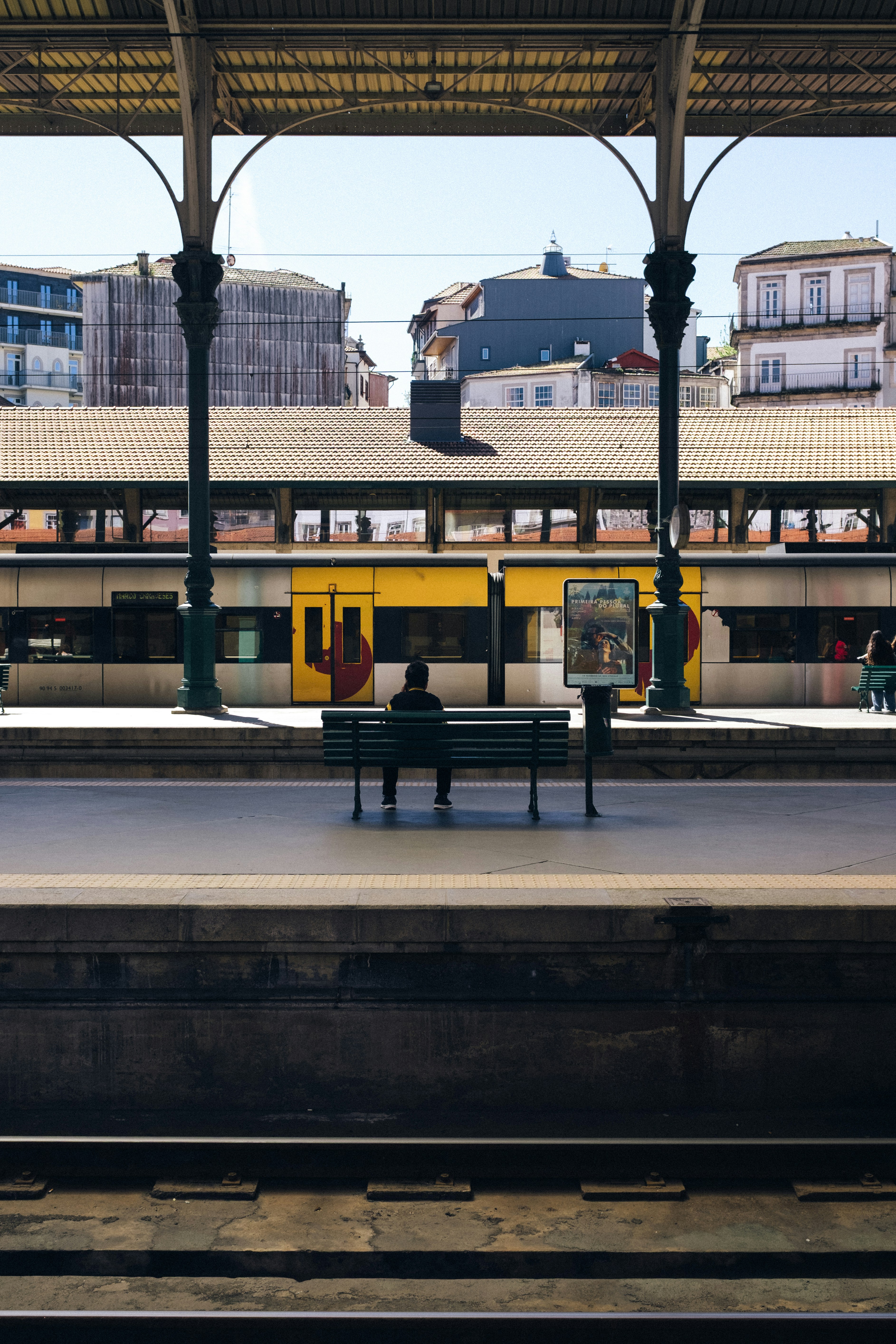 Empty Bench, Quiet Platform: A Train Station Moment Framed by Archways