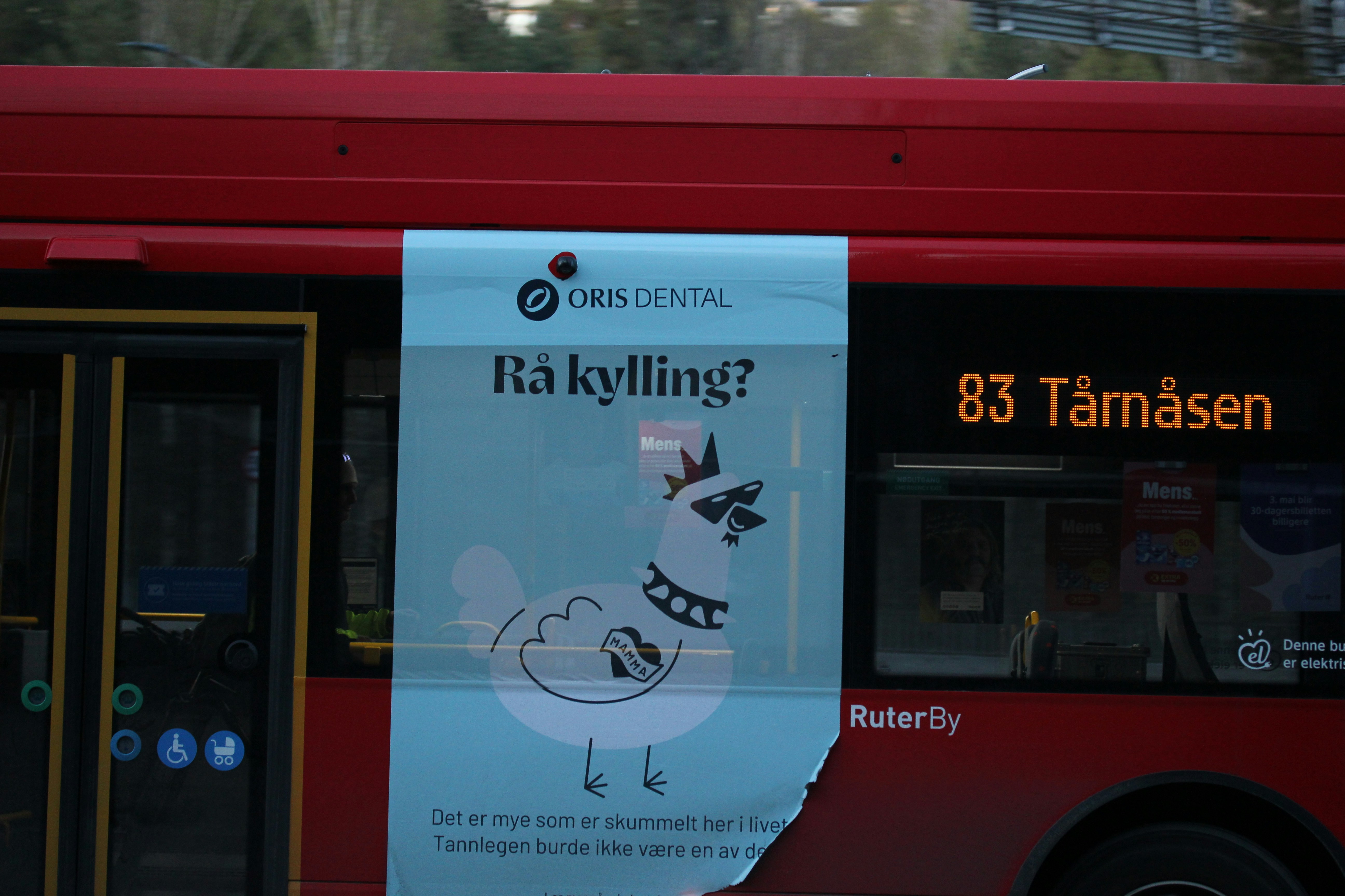 Rødtfront Bus Stop: A Quiet Moment with a Transit Ad