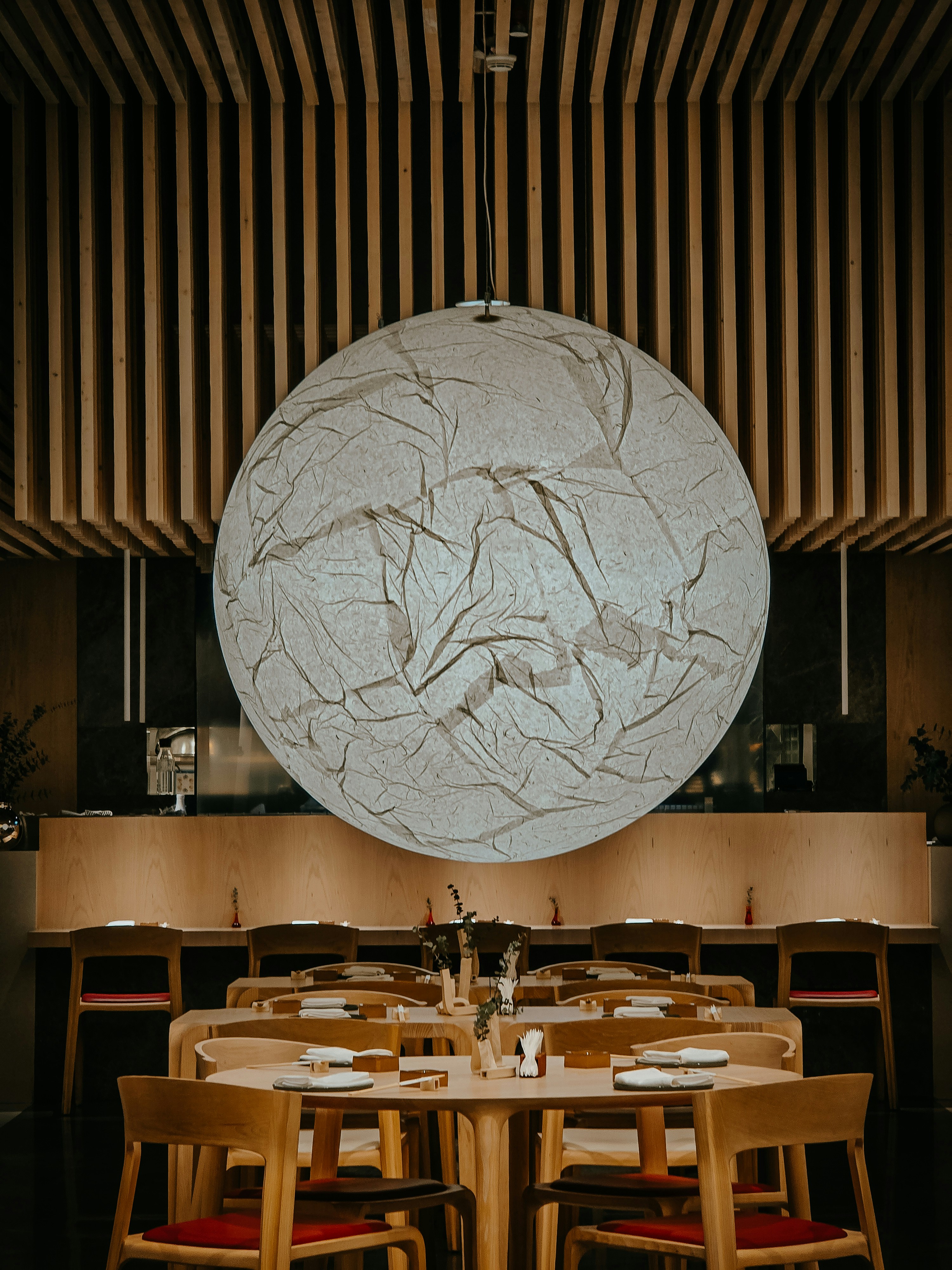 Gravity of Light: A Lantern Sphere Over a Quiet Dining Hall