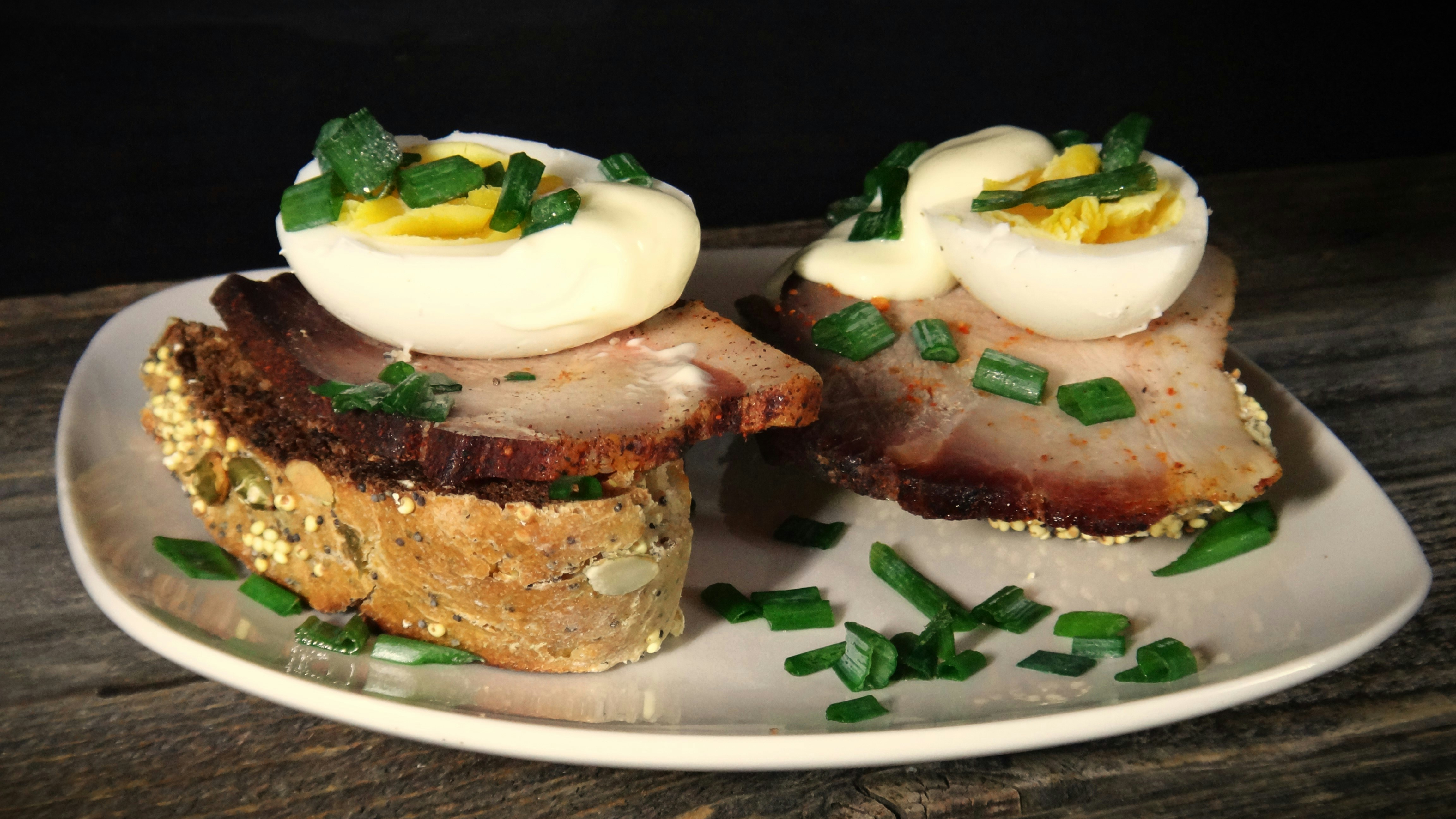 Two Open-Faced Toasts Crowned with Cream and Garnish