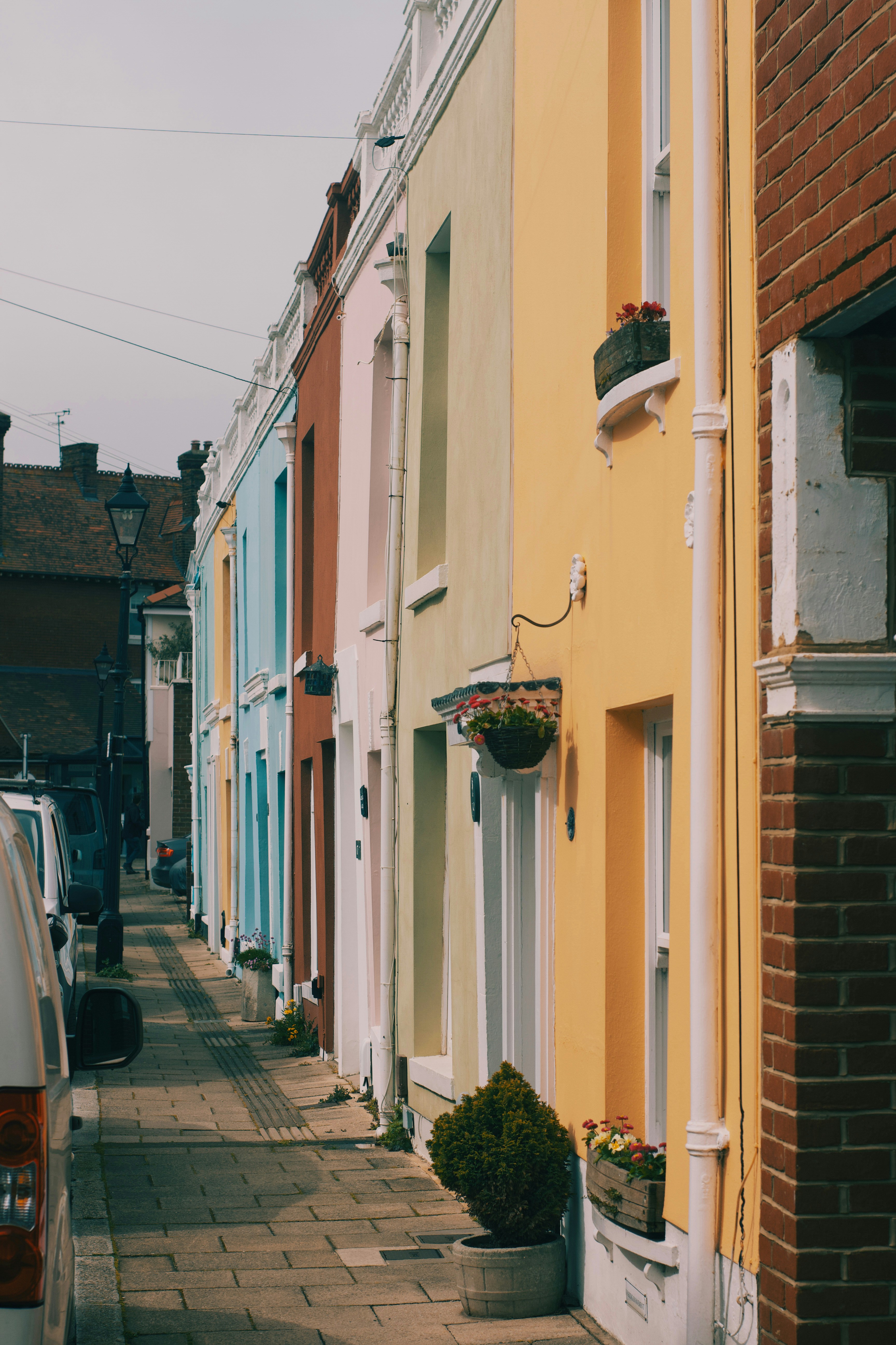 A Quiet Parade of Painted Facades along a Narrow Street