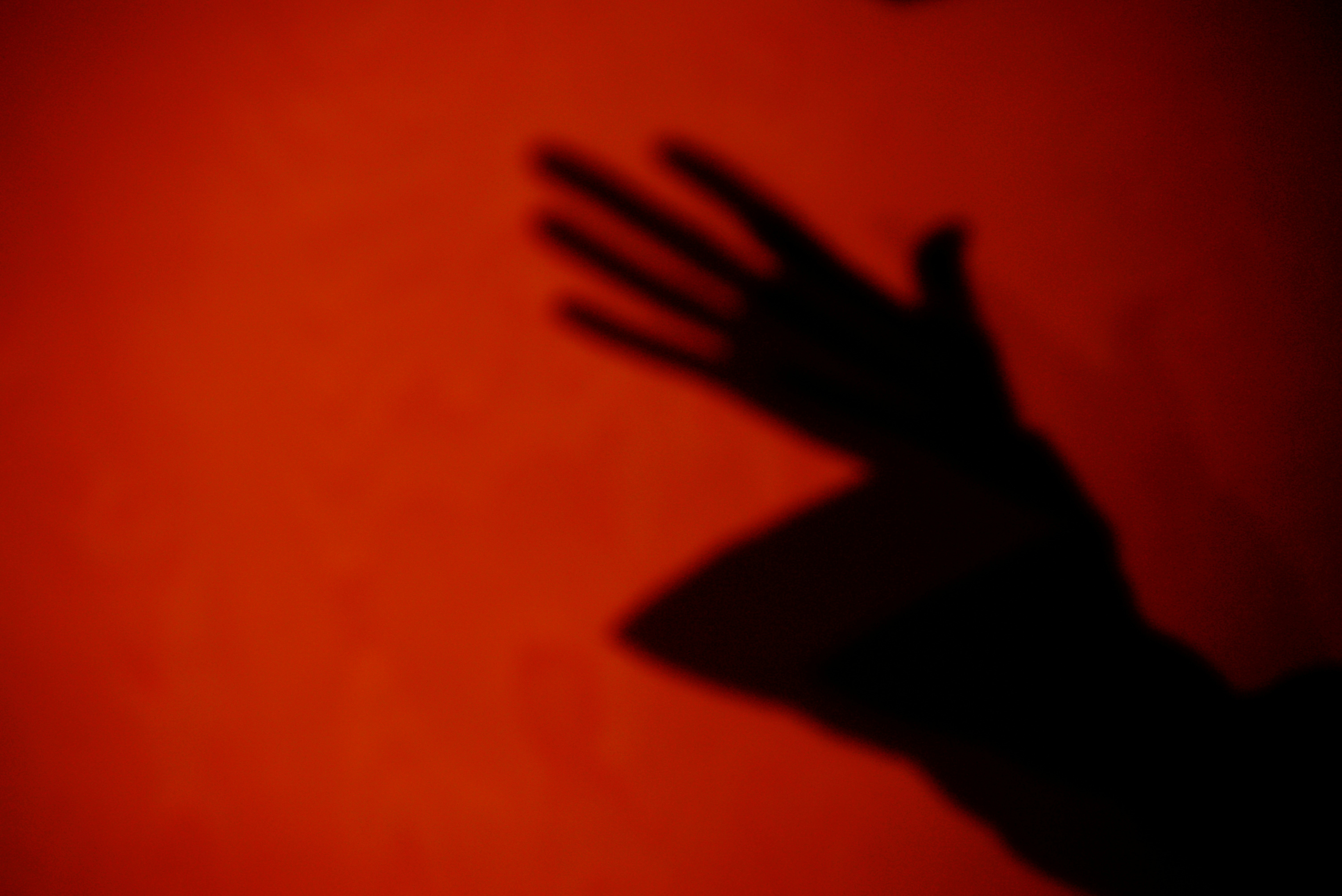 Shadow Hand in Red Veil: A Mystical Glimpse