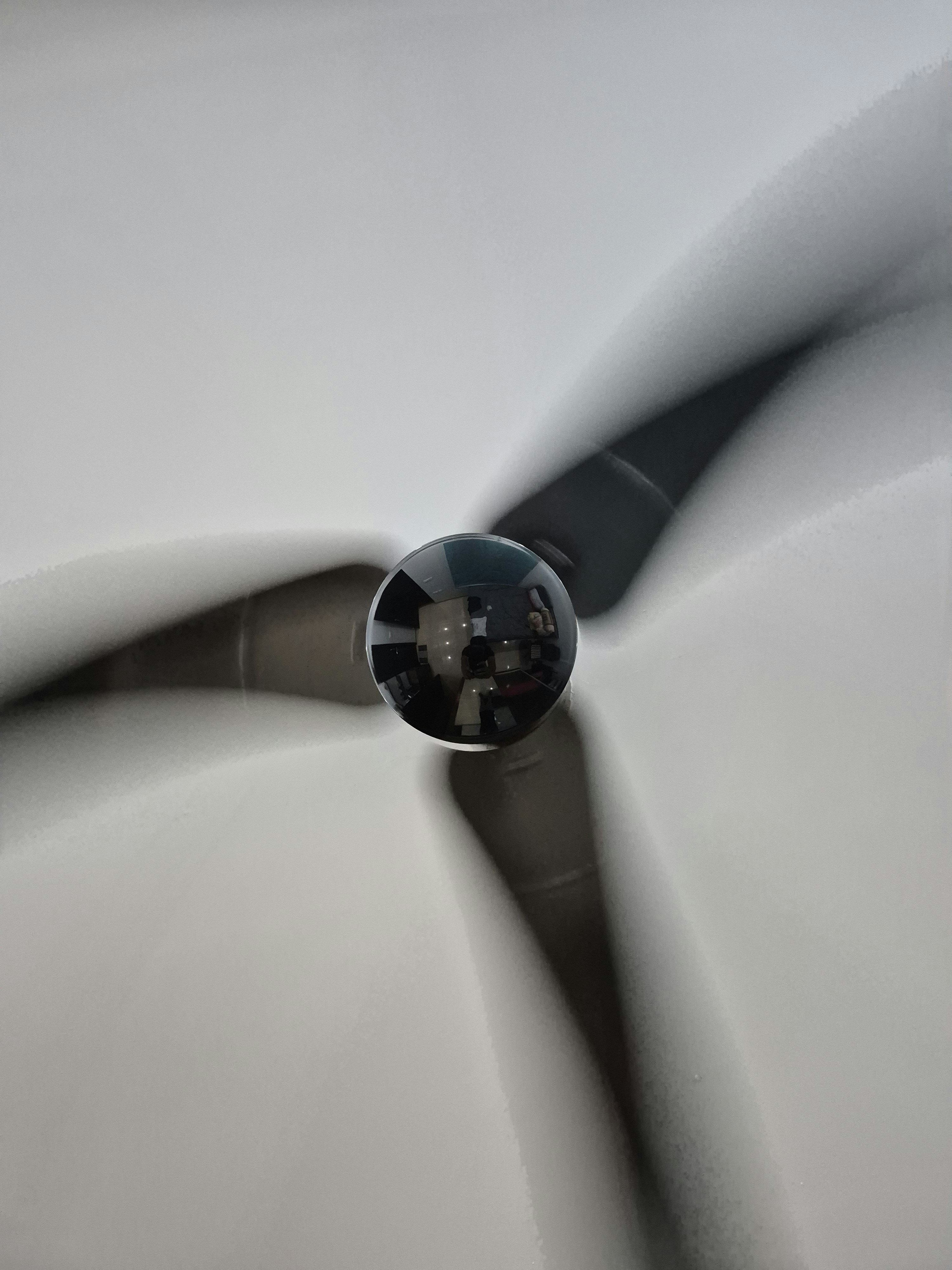 Central Ball Reflects a Turbine Break: A Close-Up of a Fan Hub