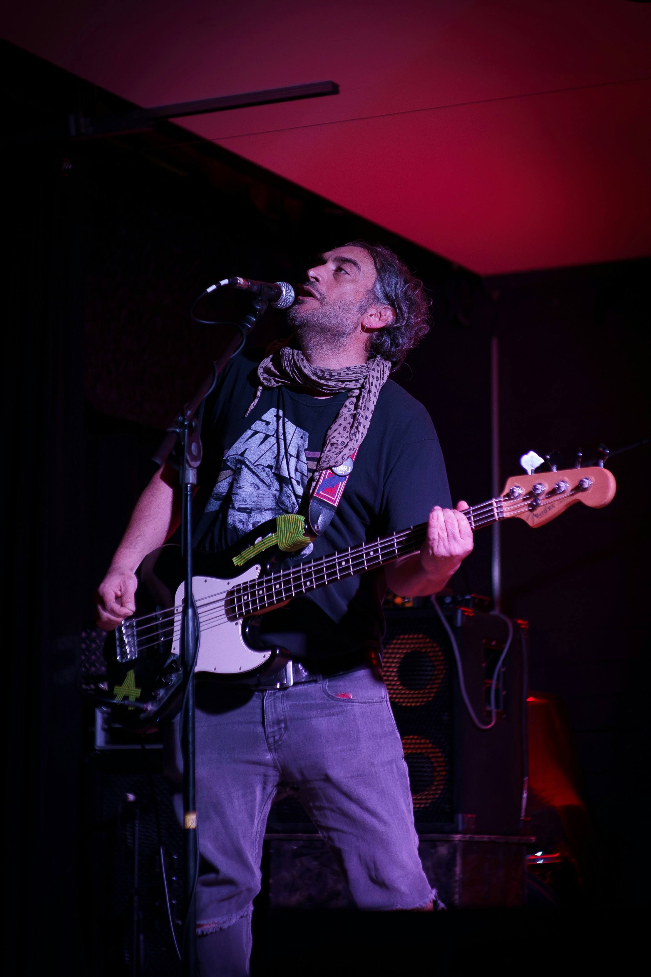 Midnight Groove: The Bassist Marks the Beat Under Neon Spotlight