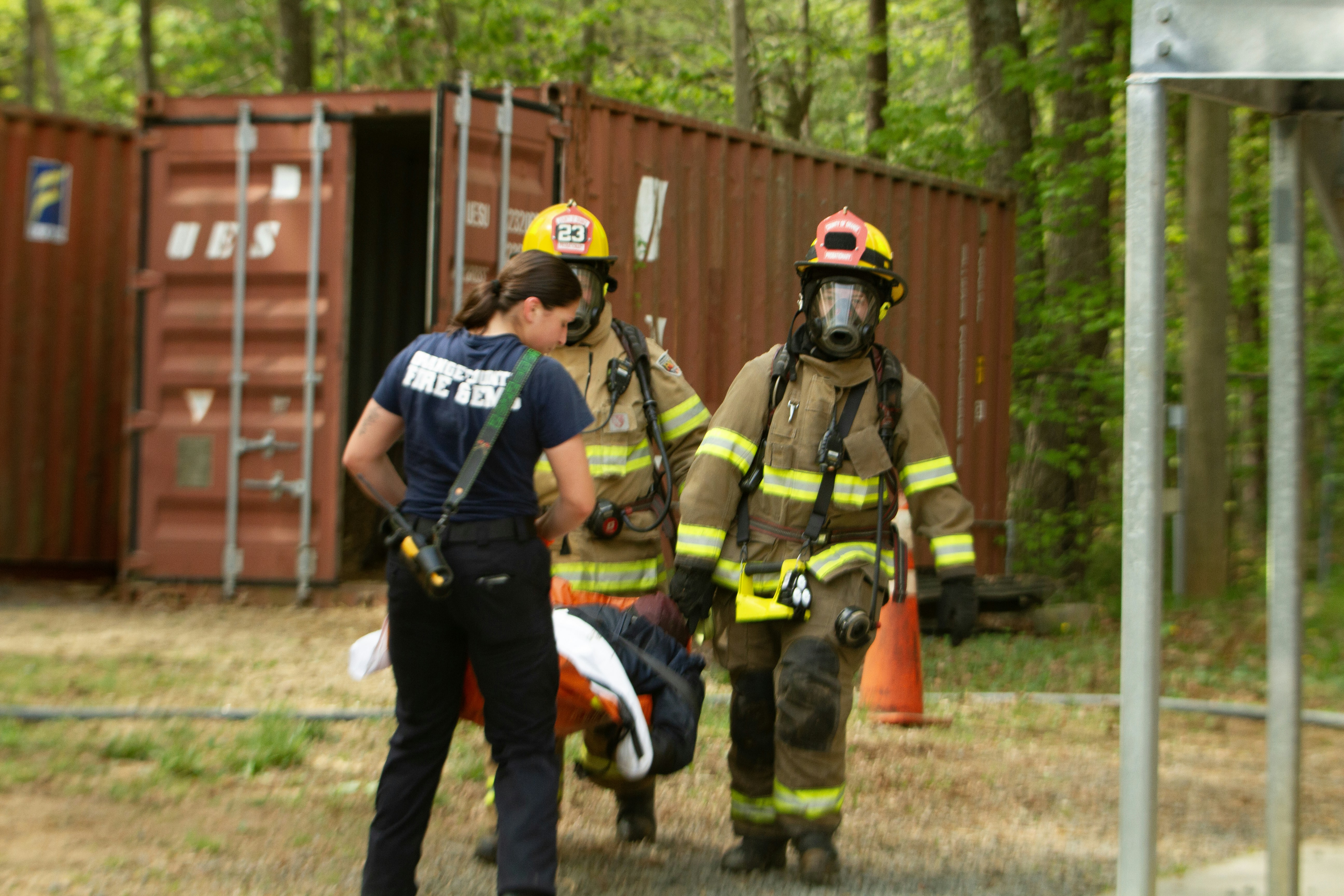 Emergency Team Standby: Firefighters Prepare as Medically Assisted Rescue Unfolds