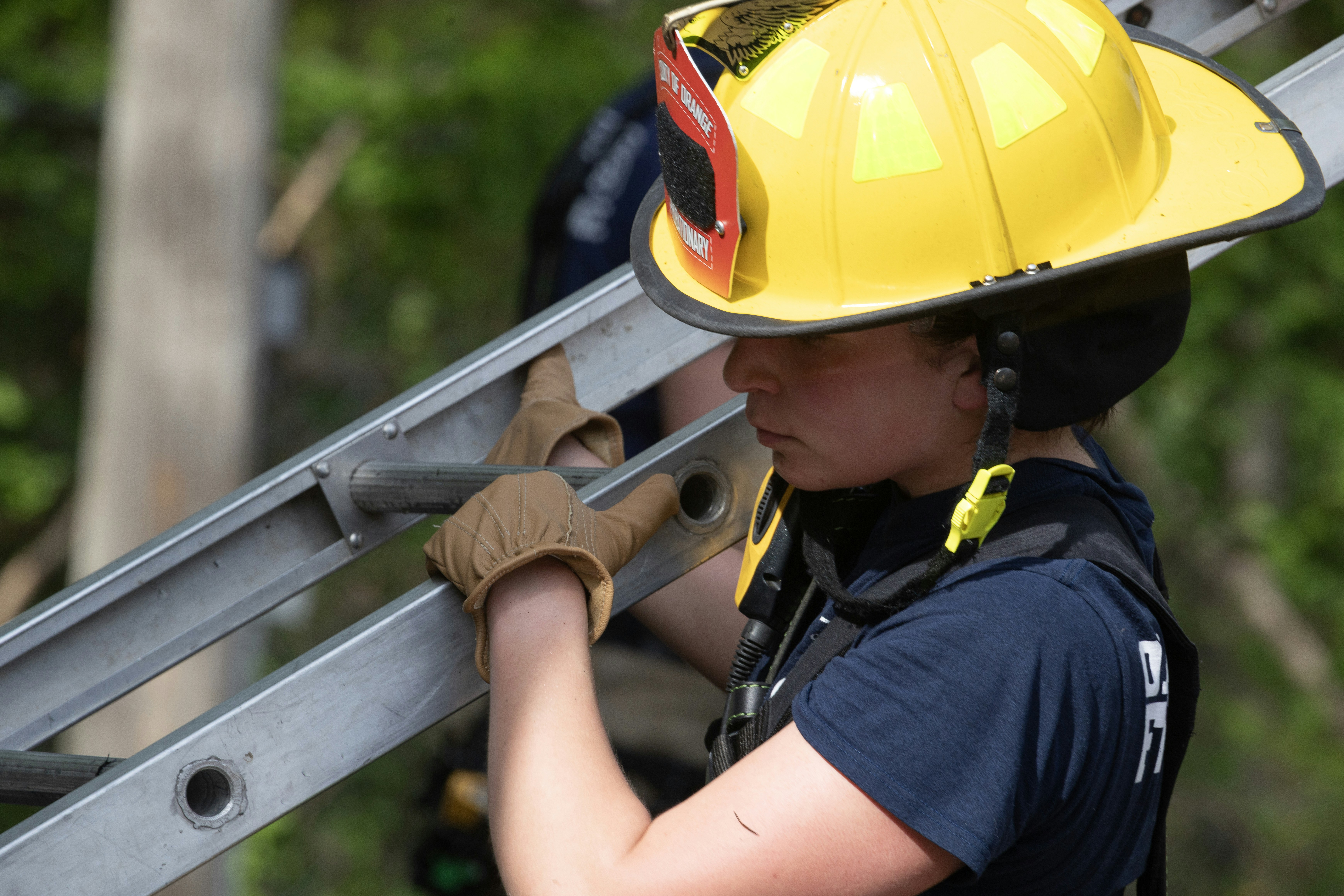 Raising a Ladder: Focused Grit of a Young Firefighter