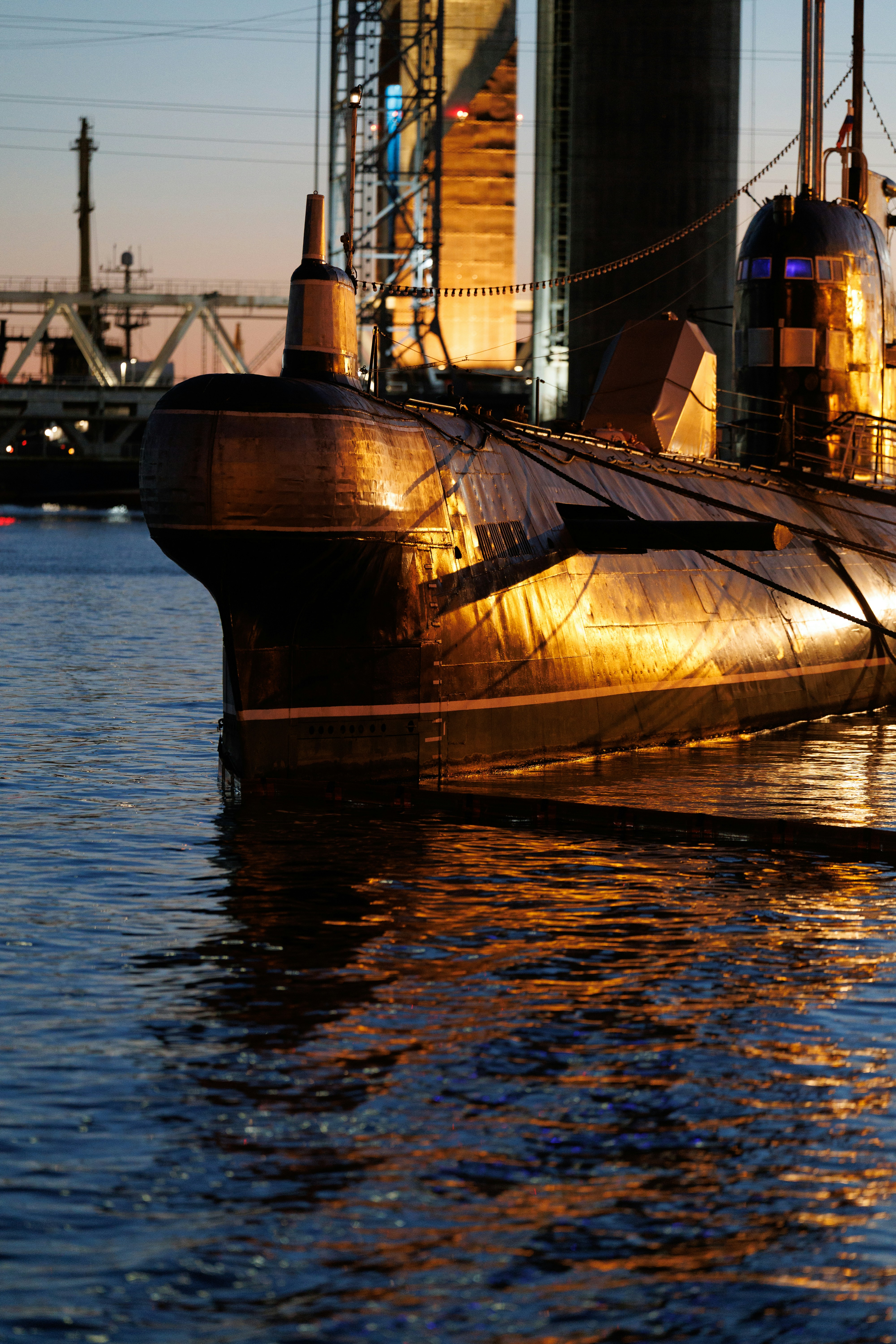 Bronze Tug at Dusk: A Harbor Behemoth Resting by the Docks