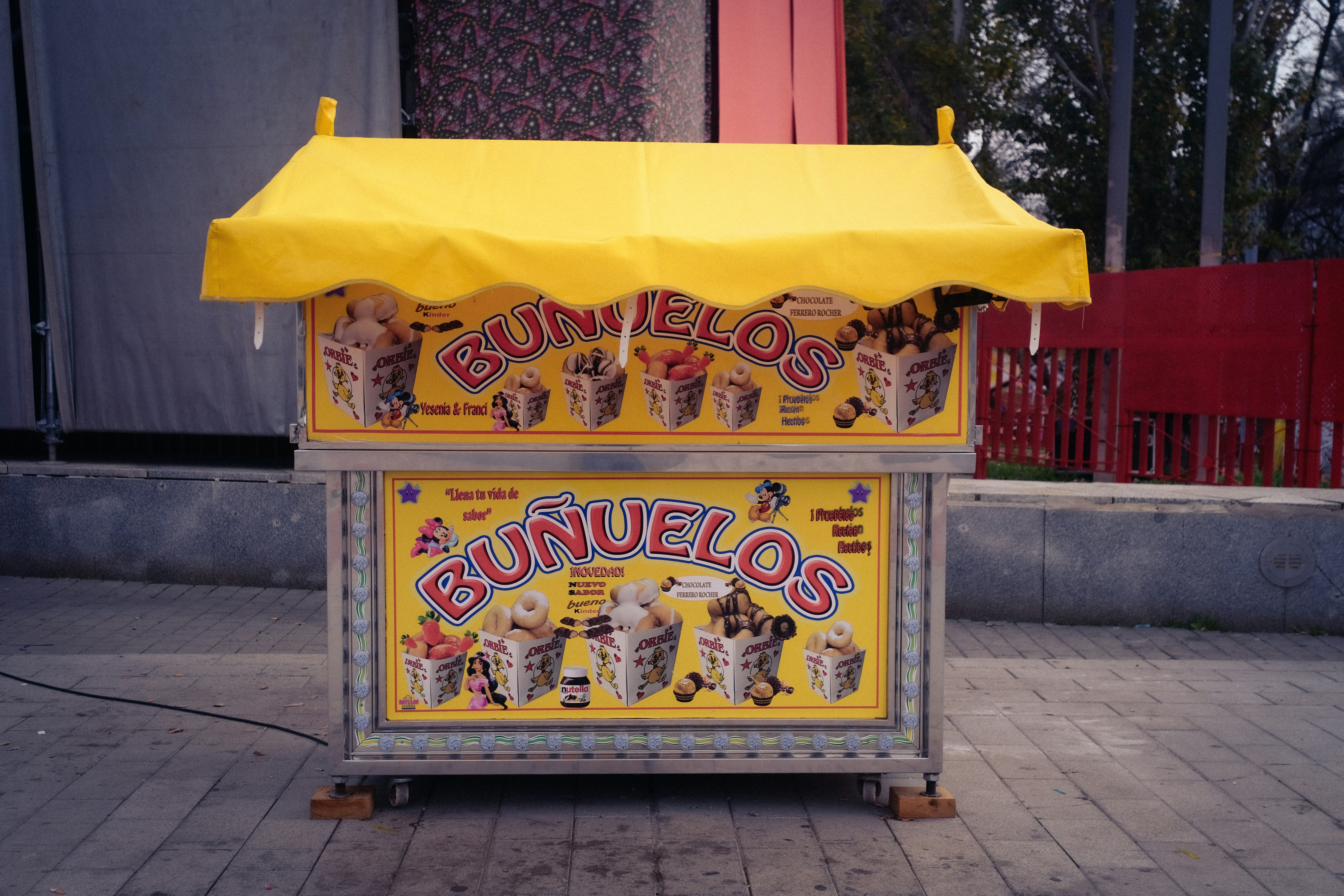 Yellow-topped Ice Cream Cart in a Quiet Plaza