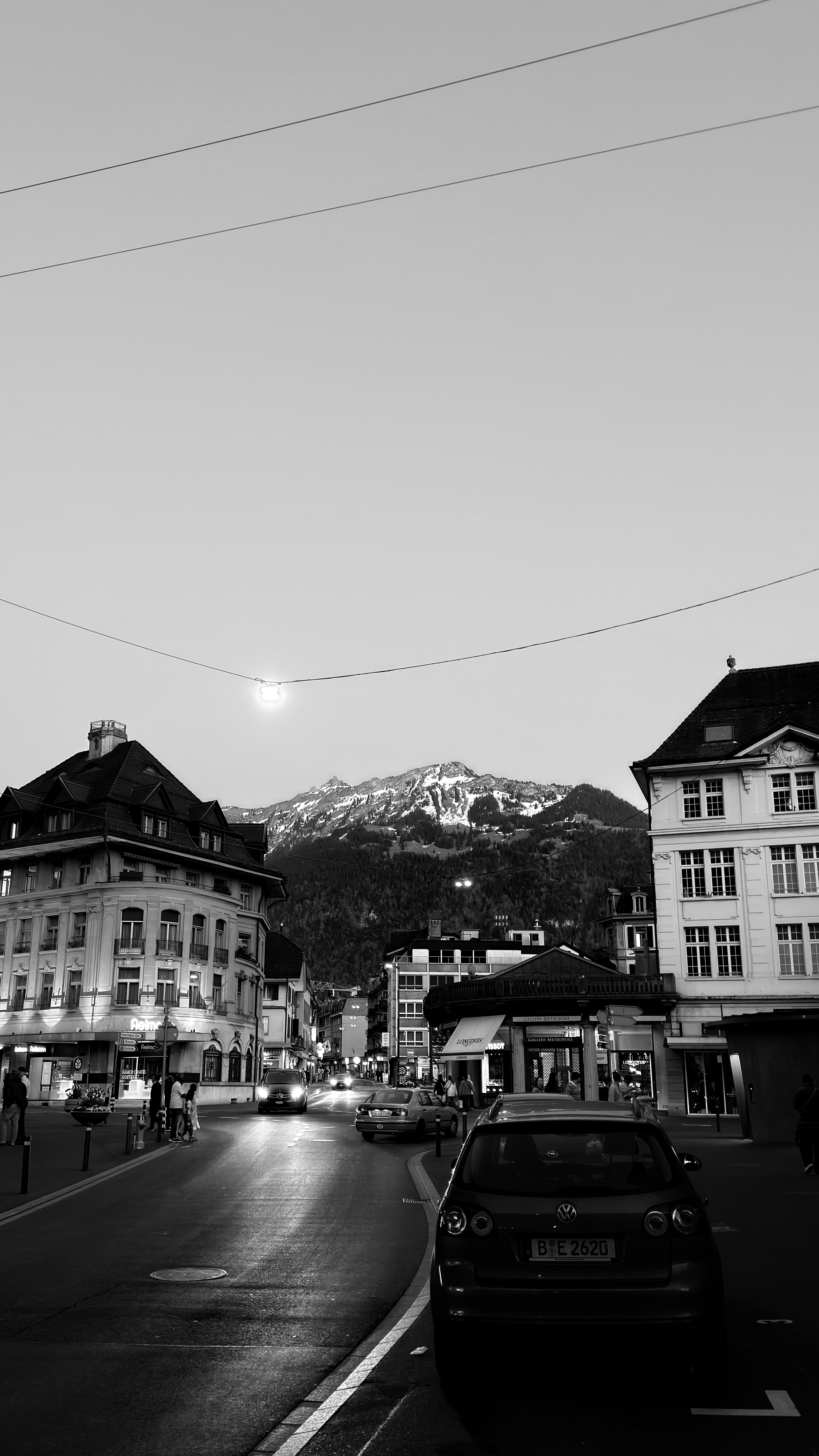 Nightfall on a Alpine Street Amid Streetcar Wires