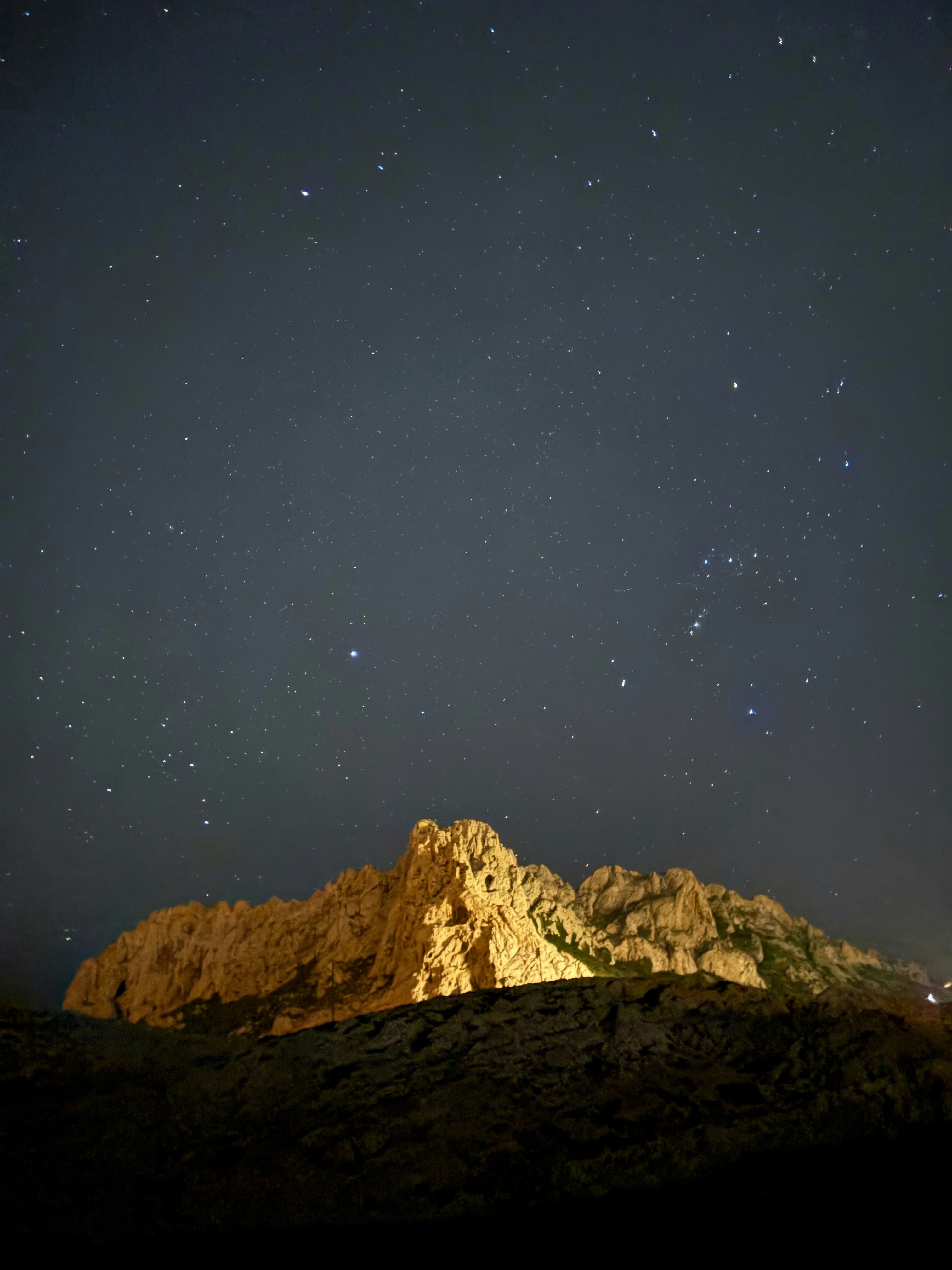 Moonlit Summit Under a Starry Veil