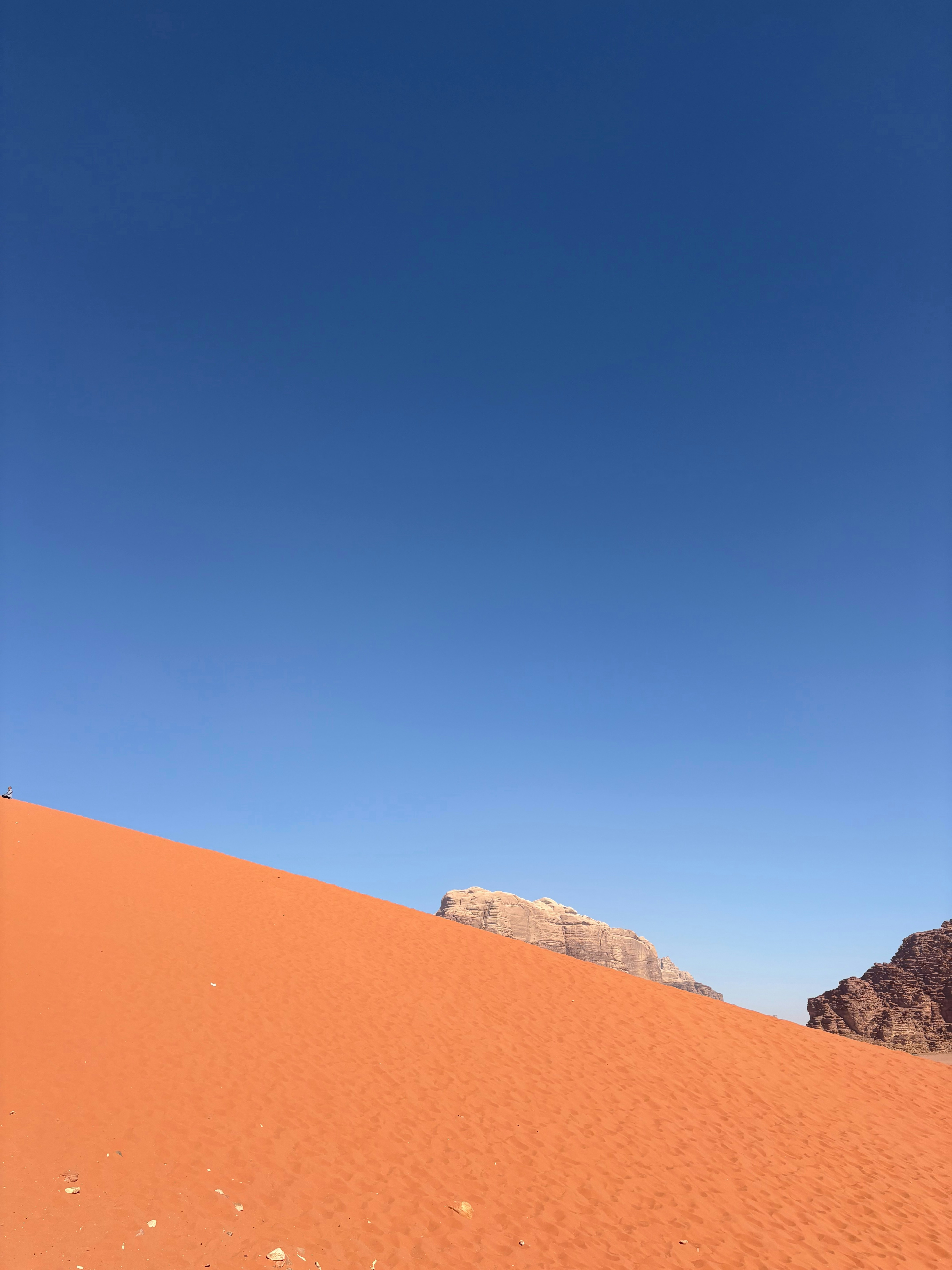Crimson Dune Beneath a Cerulean Sky