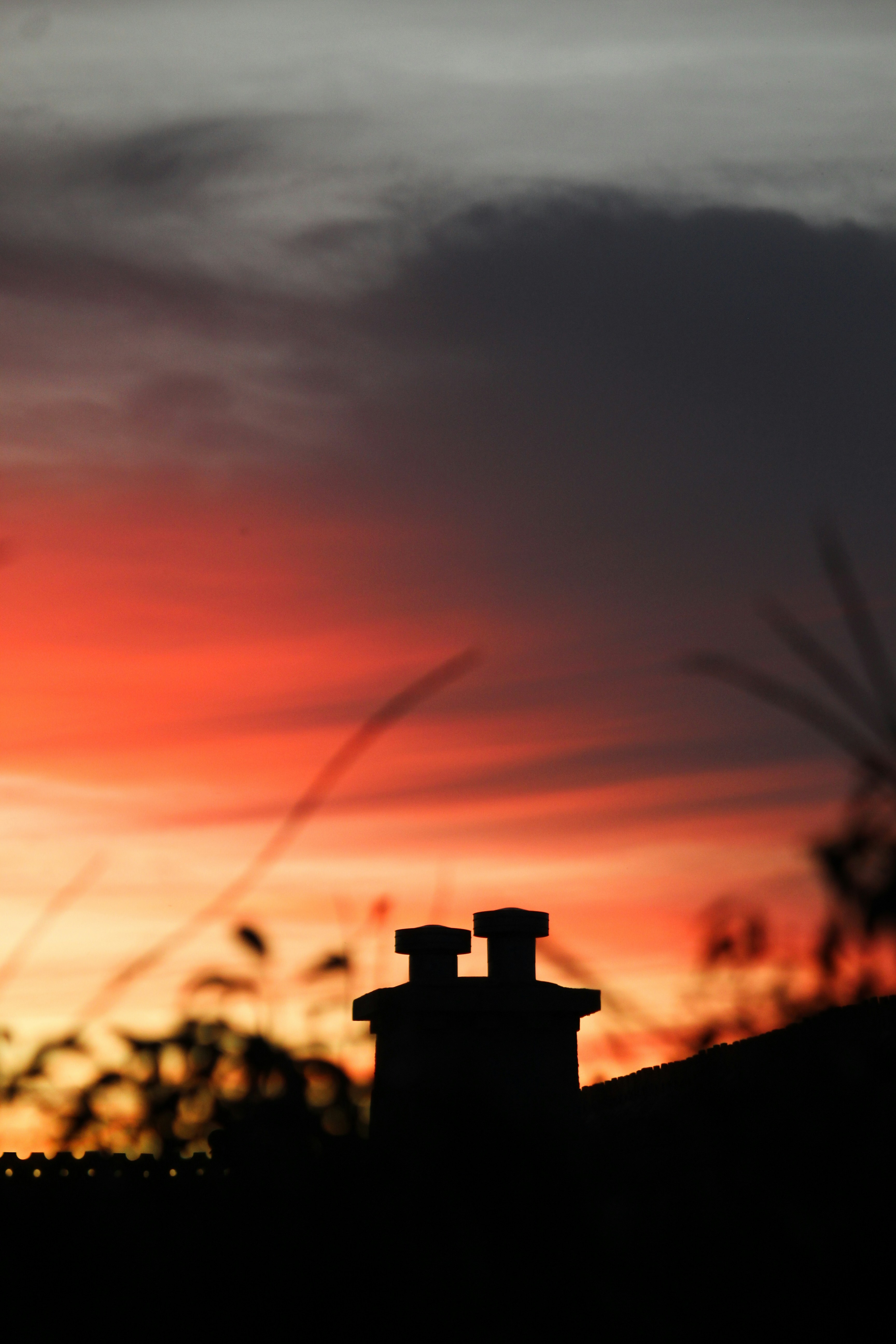 Silhouetted Chimney Peak Against a Fiery Dusk