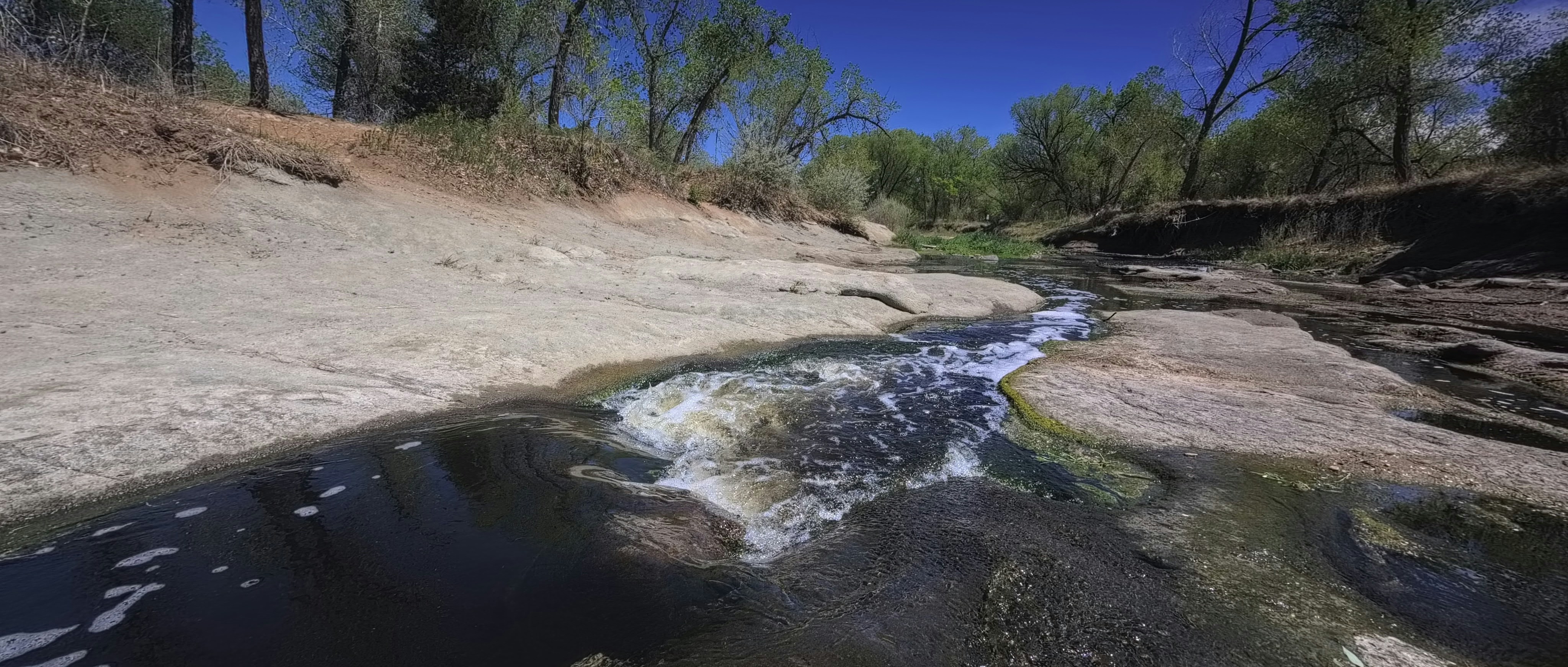 Stony Creek Ripple: A Sunlit Tidal Channel Carves Through Desert Rock