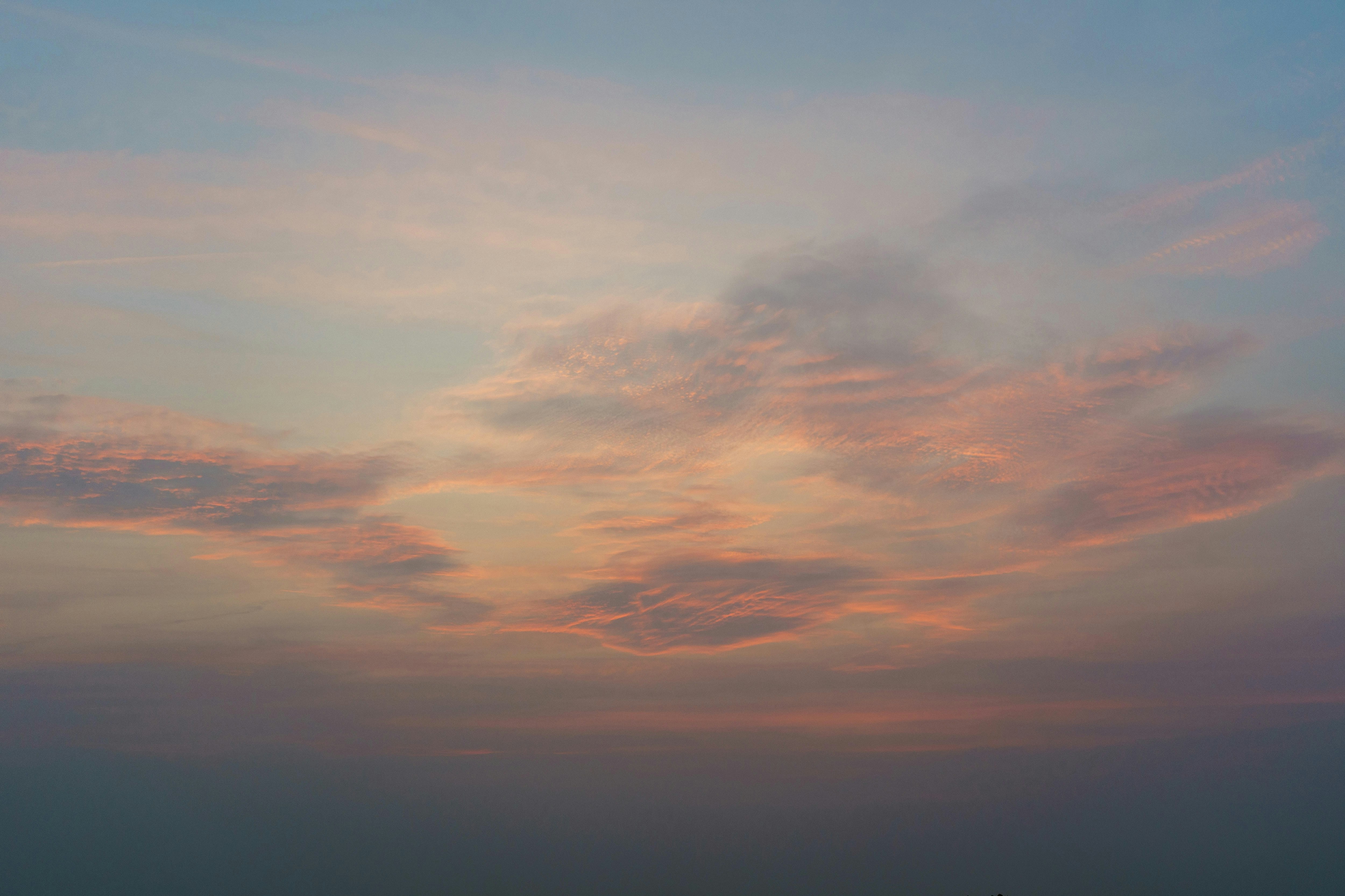 Dusk Embrace: Gentle Clouds Over a Quiet Horizon