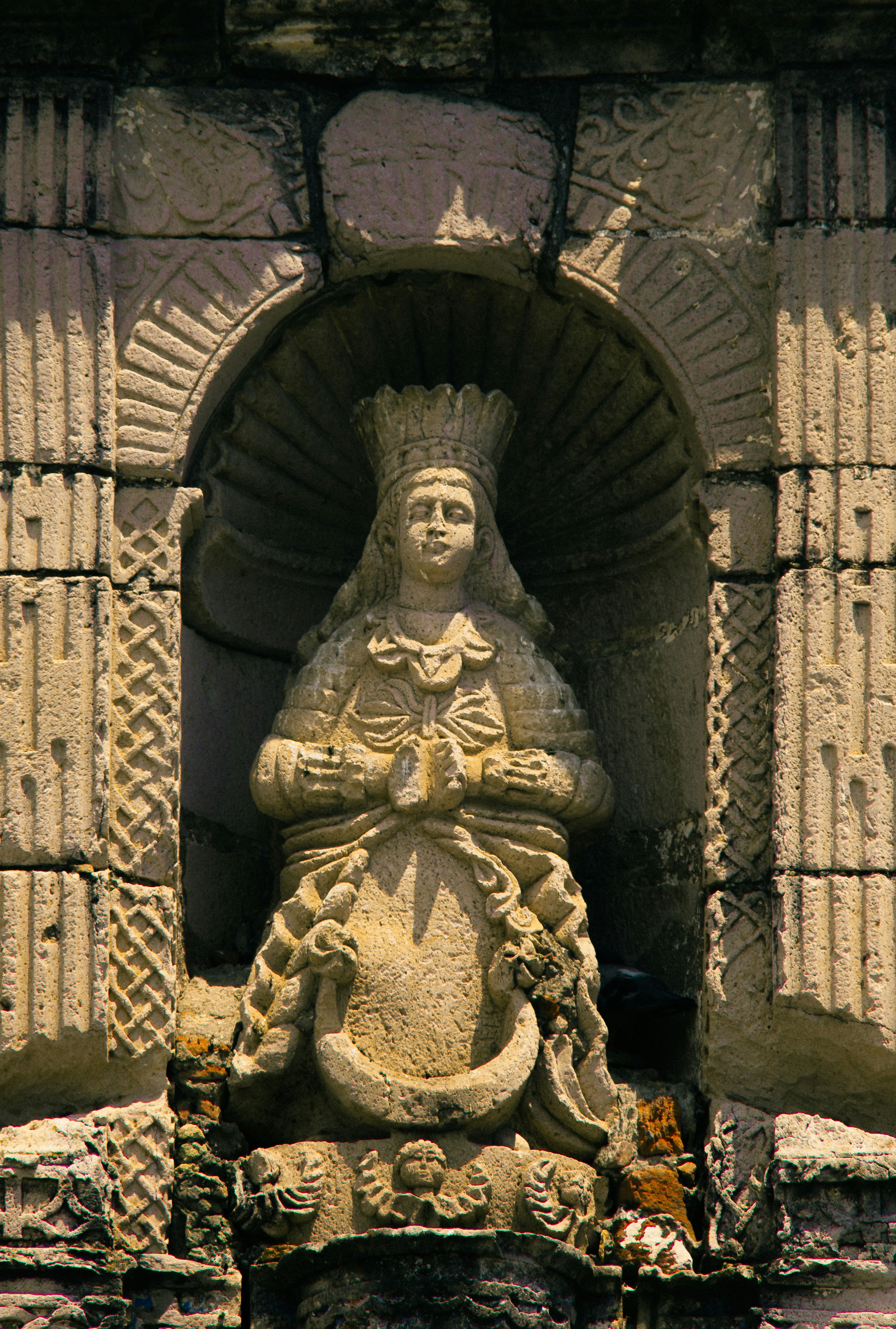 Stone Carved Guardian Within Carved Archway