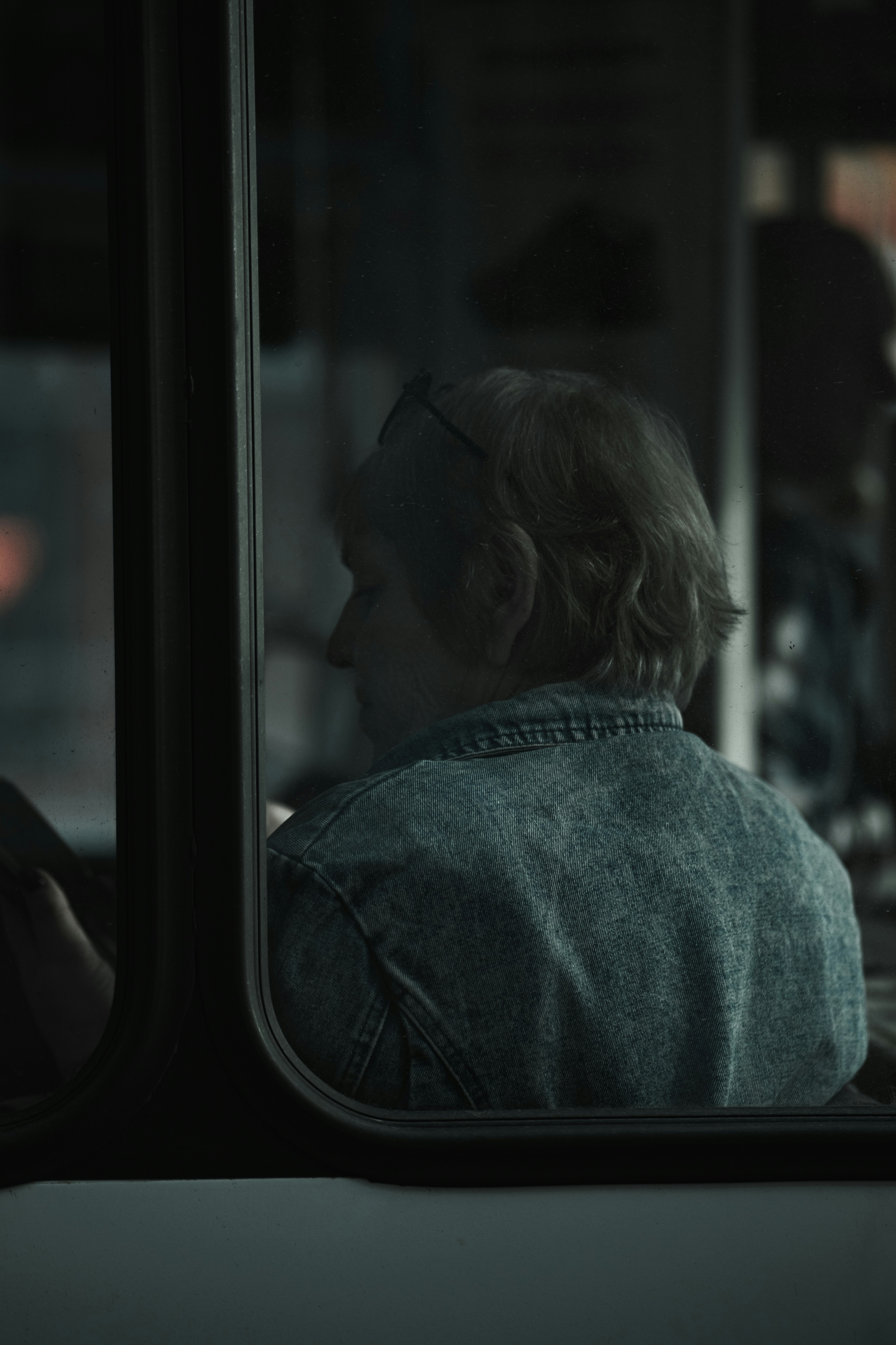 Veiled Portrait Through a Bus Window