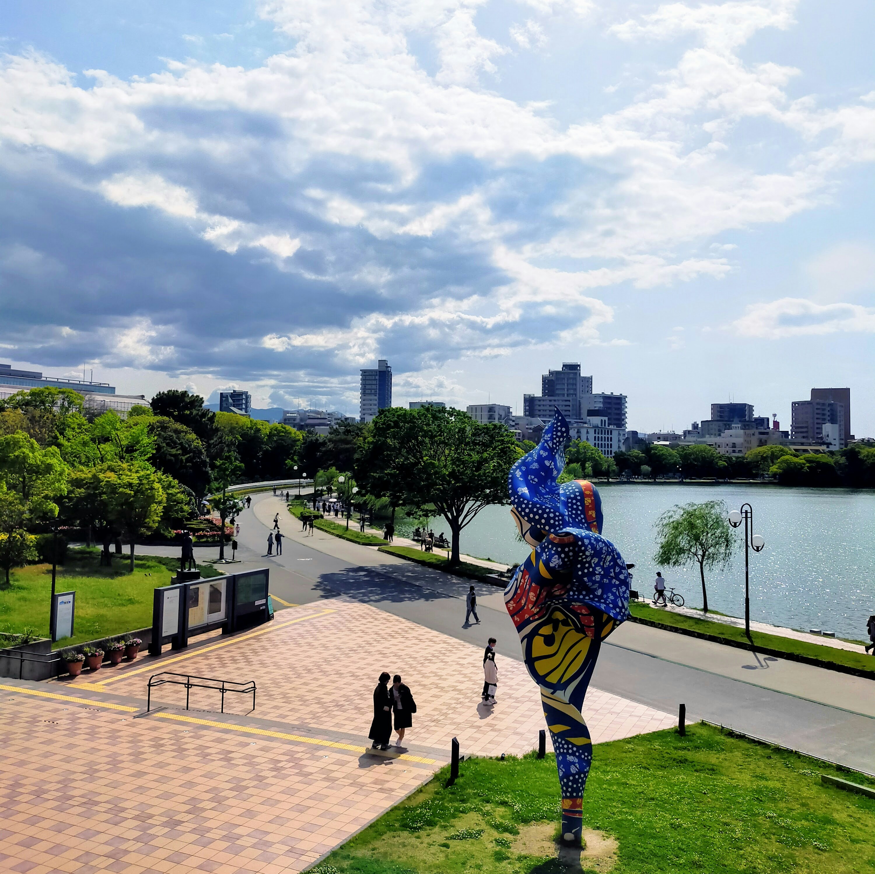 Blue Sculpture by the Riverside: A Quiet Urban Moment