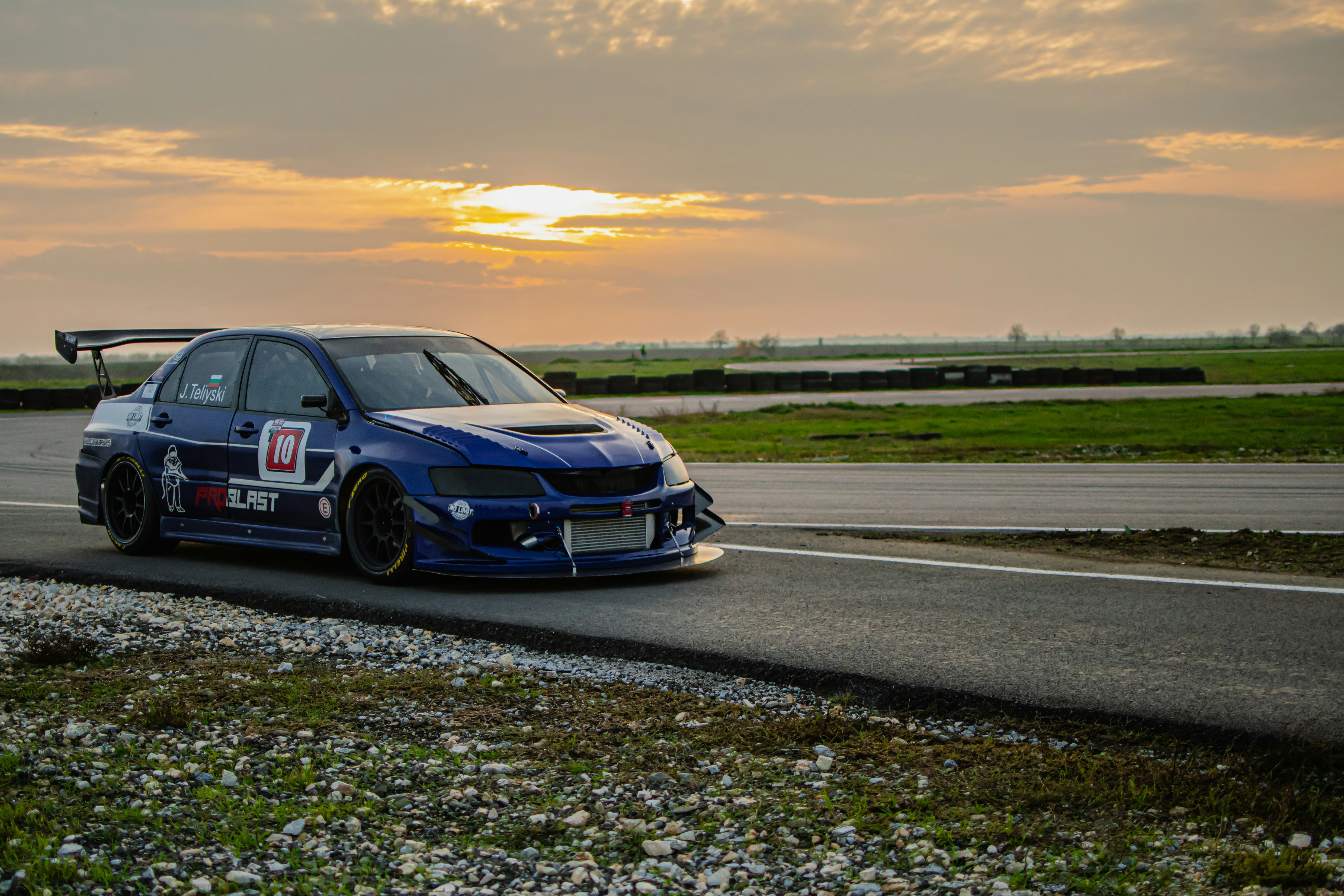 Blue Racing Spirit at Dusk: A Squint of Speed on the Track